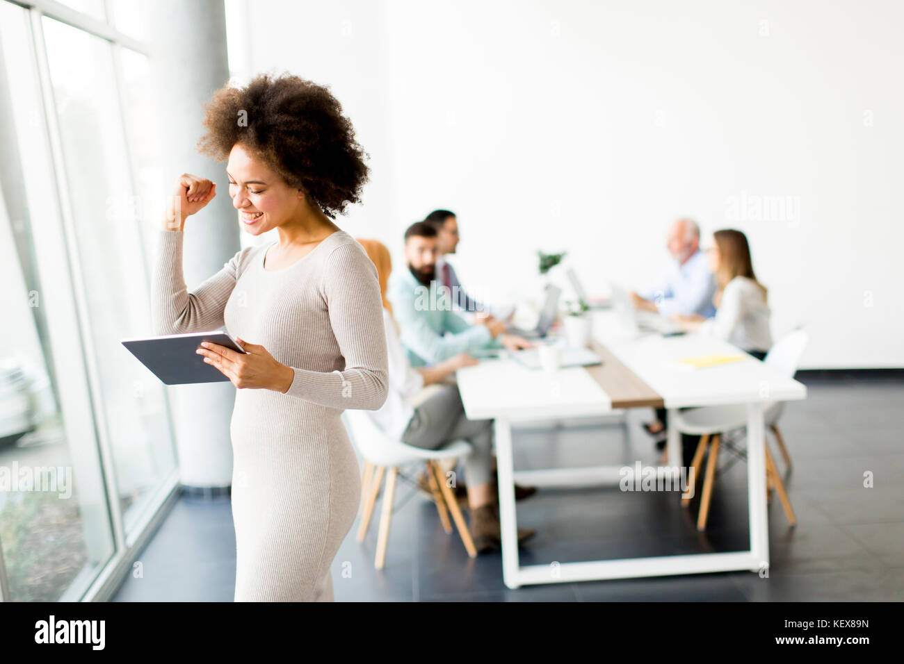 Typical business day at a modern company with multiethnic group of ...