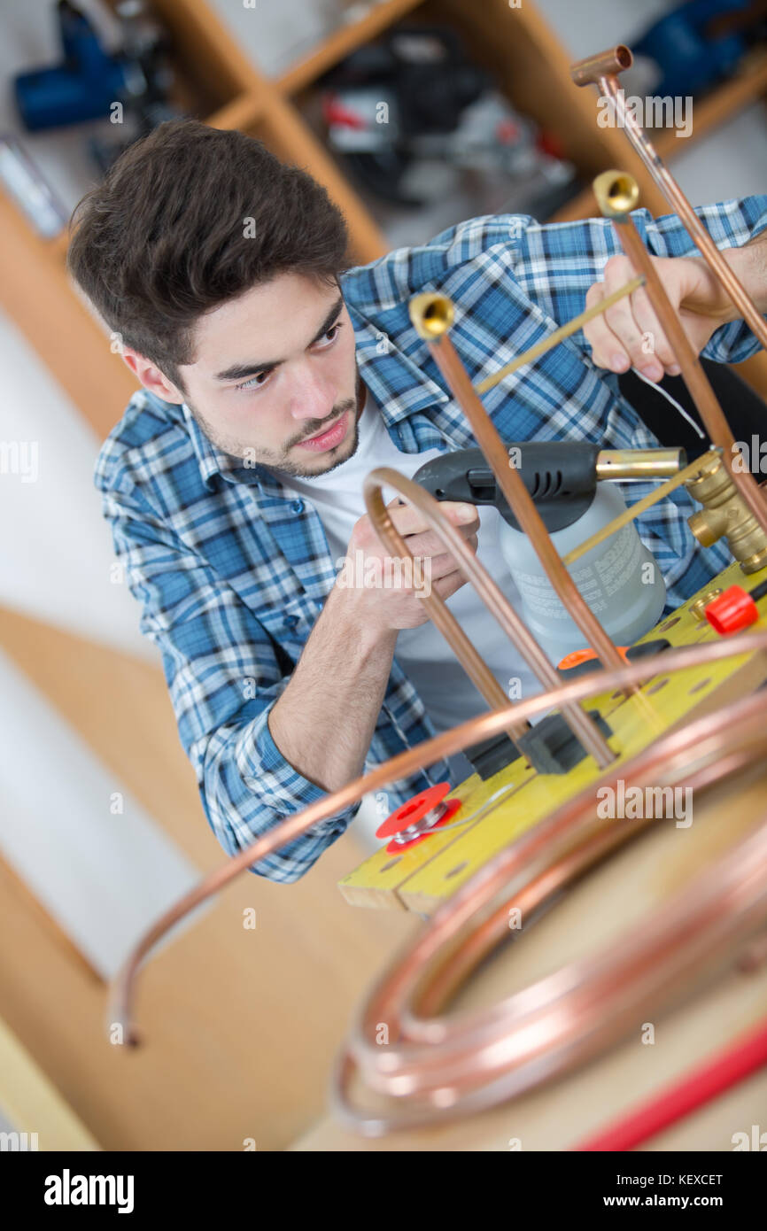 industrial plumber using blowtorch Stock Photo - Alamy