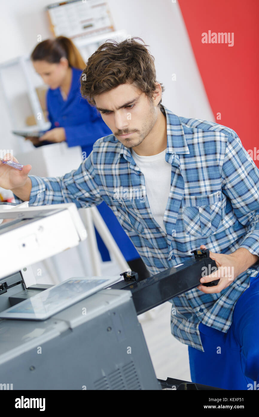 maintenance works for the office equipment Stock Photo - Alamy