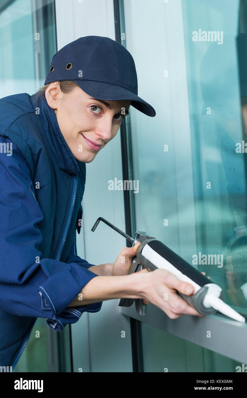 construction worker installing window in house Stock Photo - Alamy