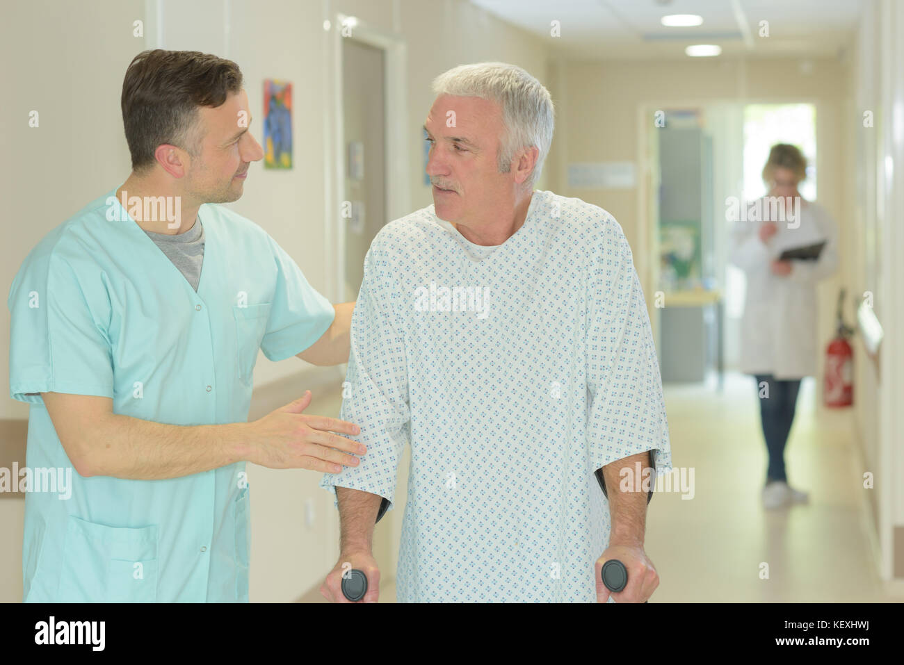 assisting a patient Stock Photo - Alamy