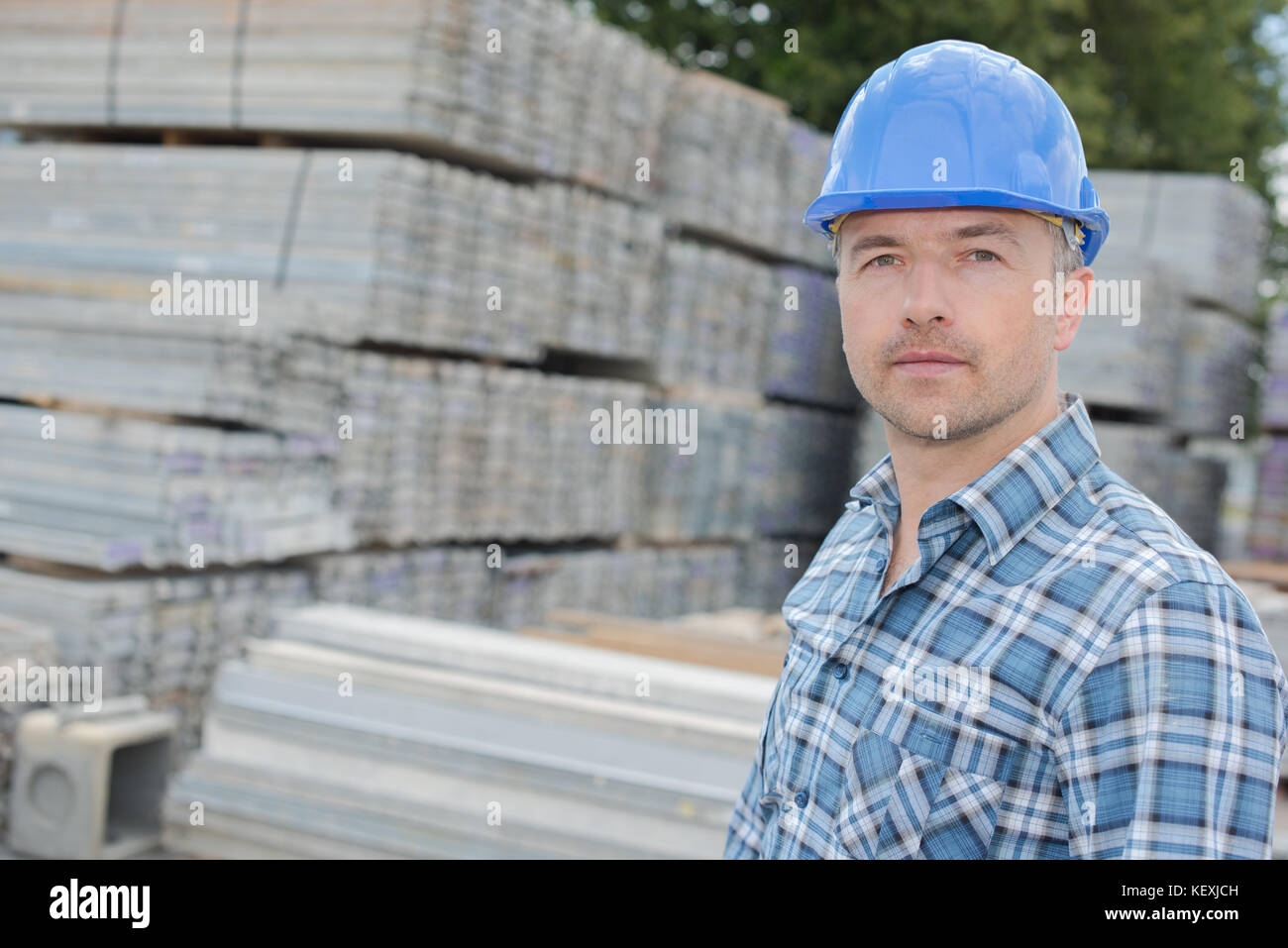 Man in materials yard Stock Photo - Alamy