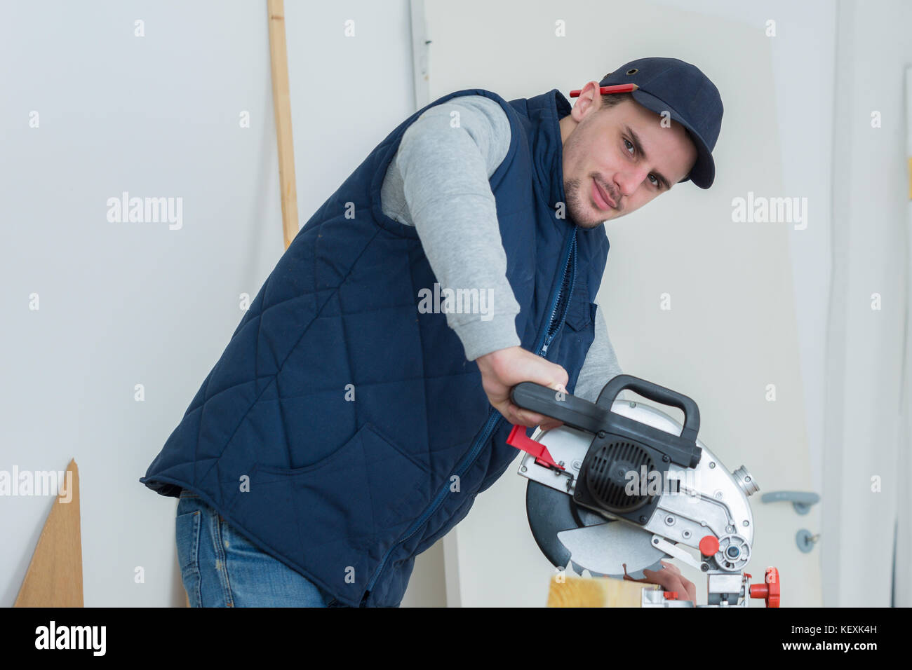 builder cutting a wood Stock Photo - Alamy