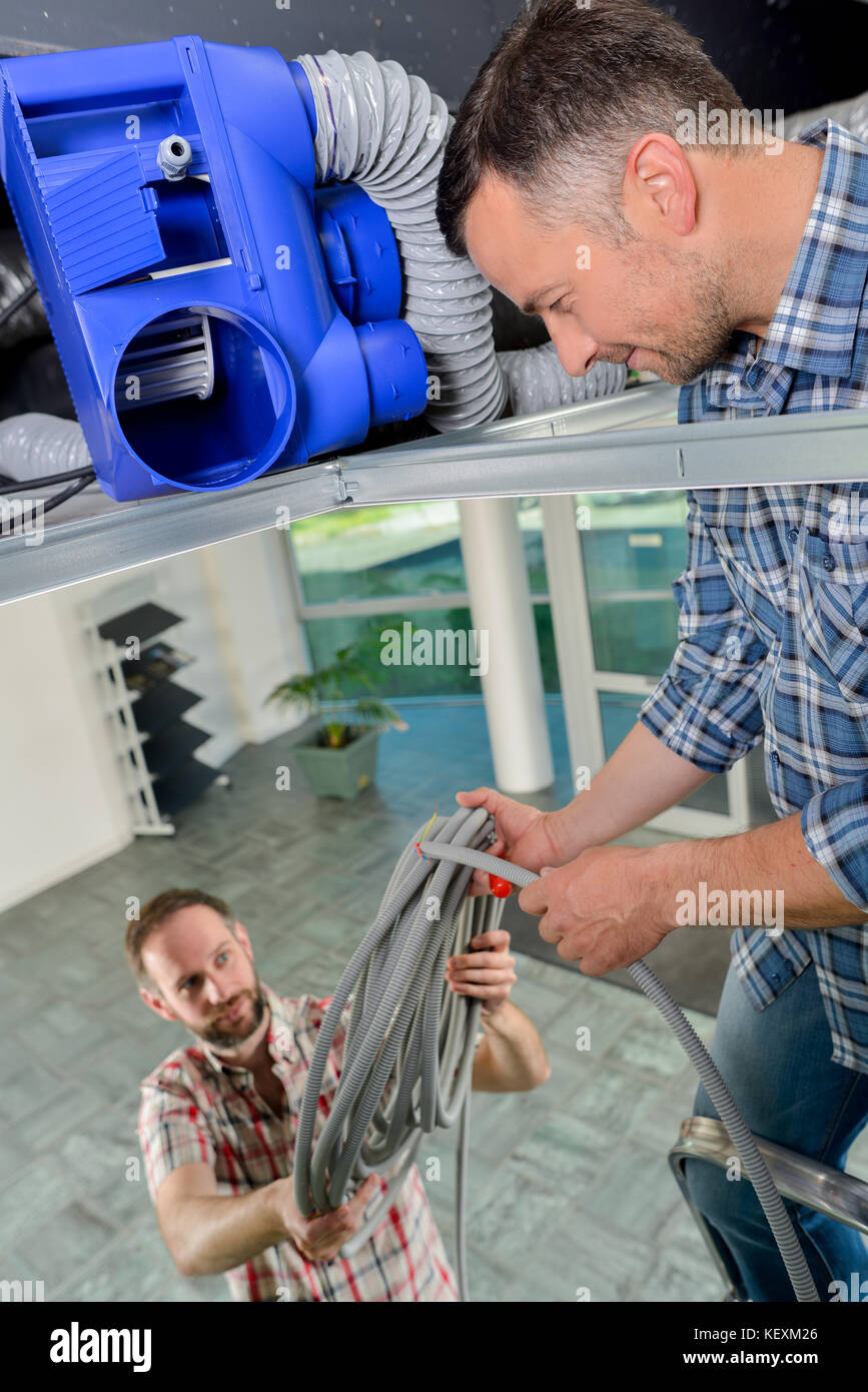 Checking ceiling ventilation Stock Photo - Alamy