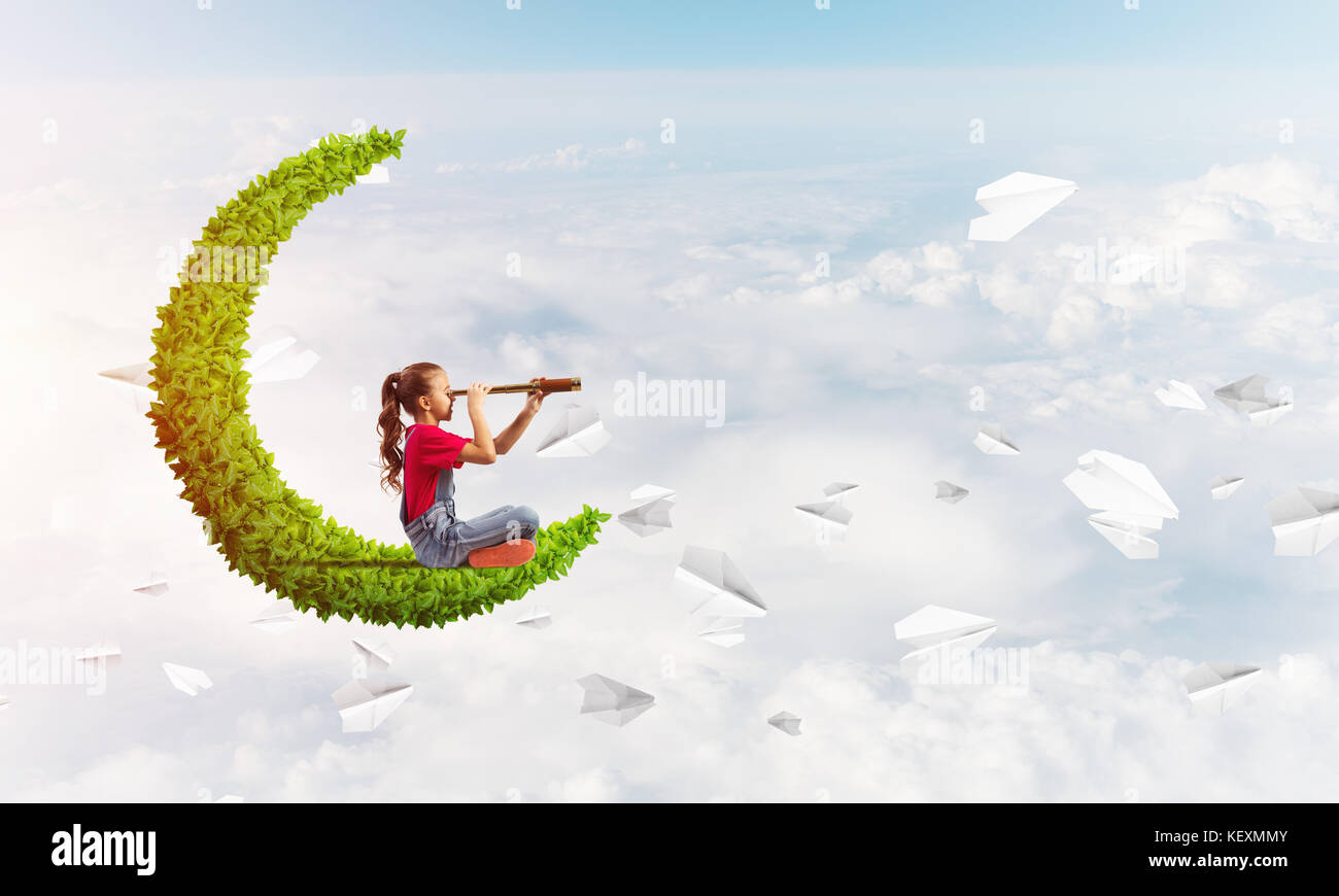 Concept of careless happy childhood with girl on green moon Stock Photo ...