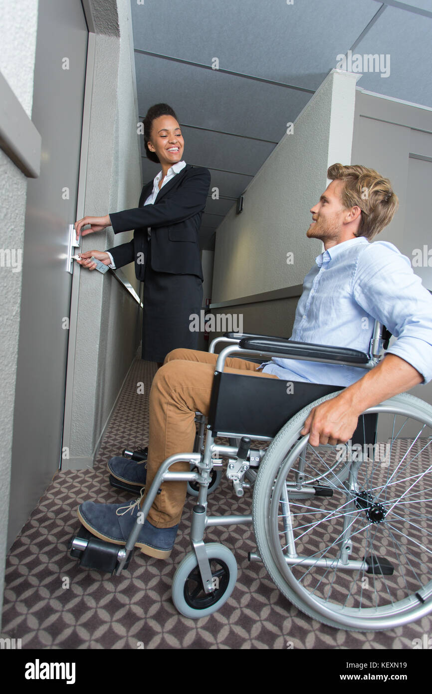 businessman being assisted at a hotel Stock Photo - Alamy