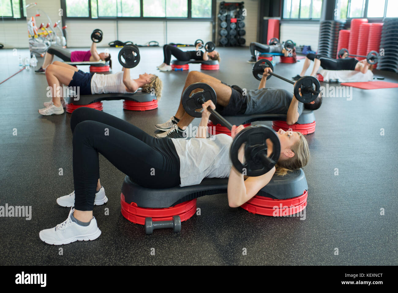 group of people doing fitness exercising in gym together Stock Photo ...