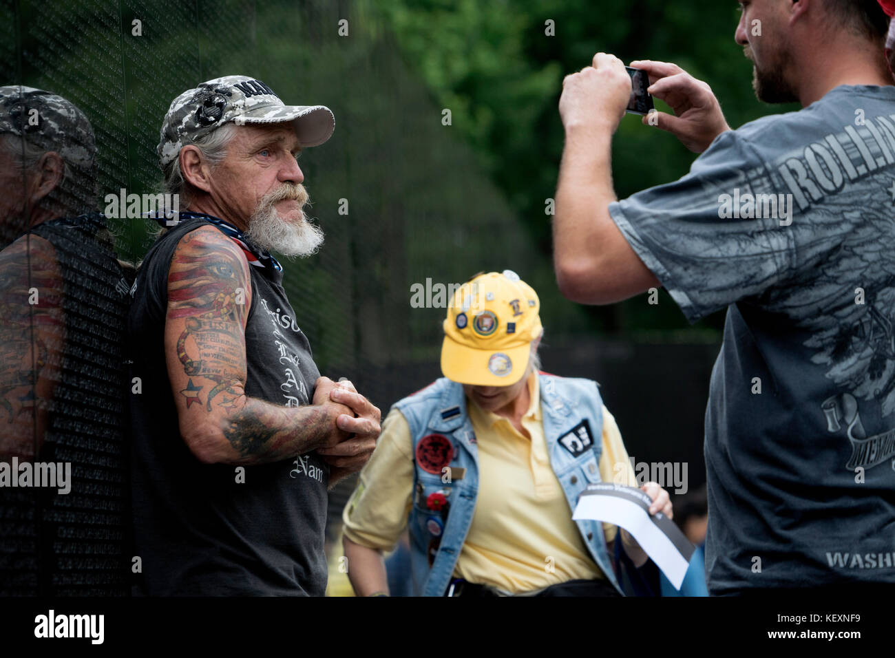 Man taking picture of veteran at Vietnam Veterans Memorial, Washington ...