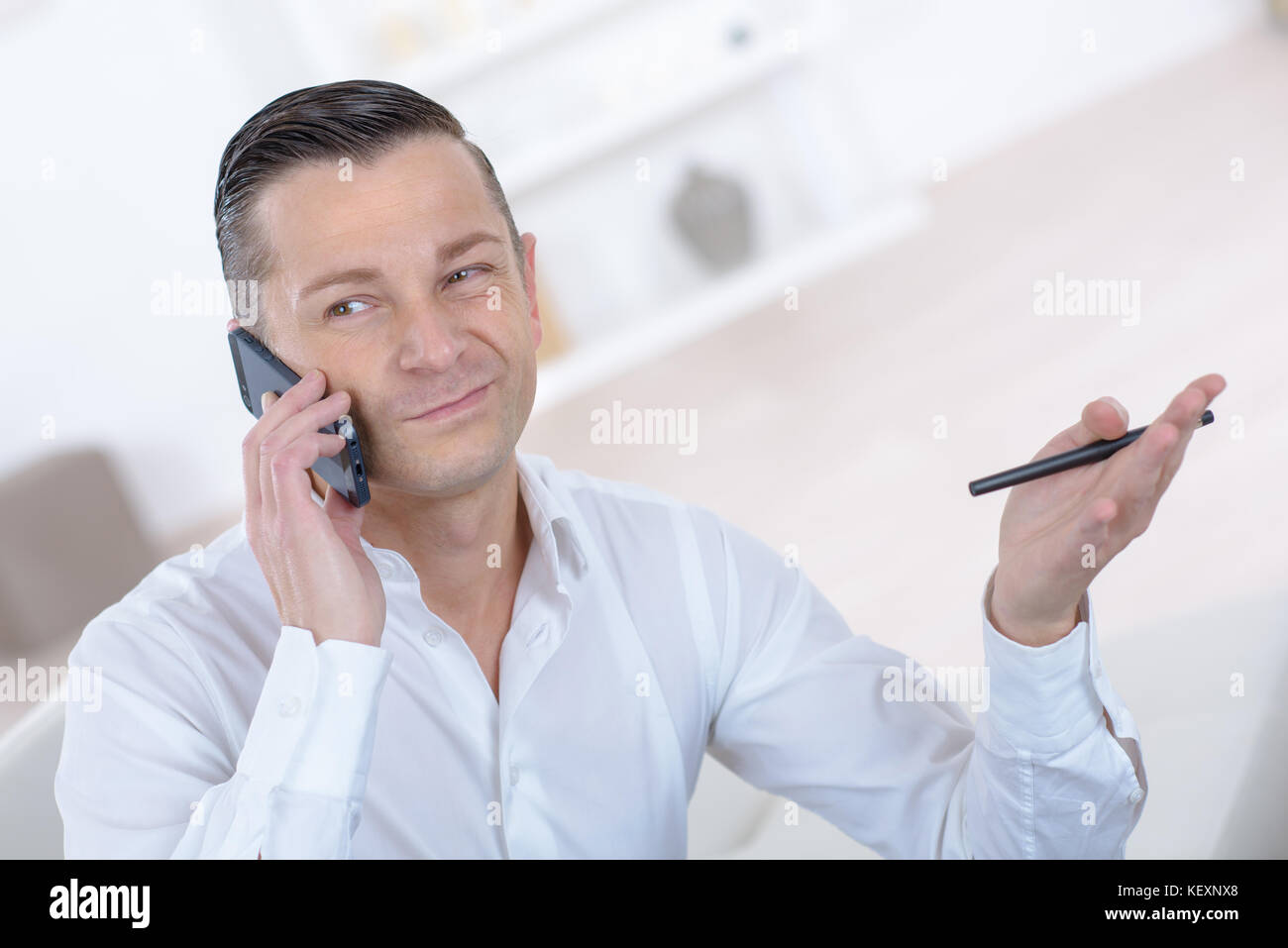 man on the phone happy with the conversation Stock Photo - Alamy