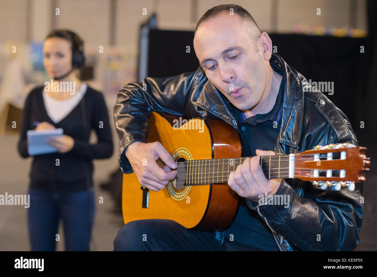 man playing on acoustic guitar Stock Photo - Alamy