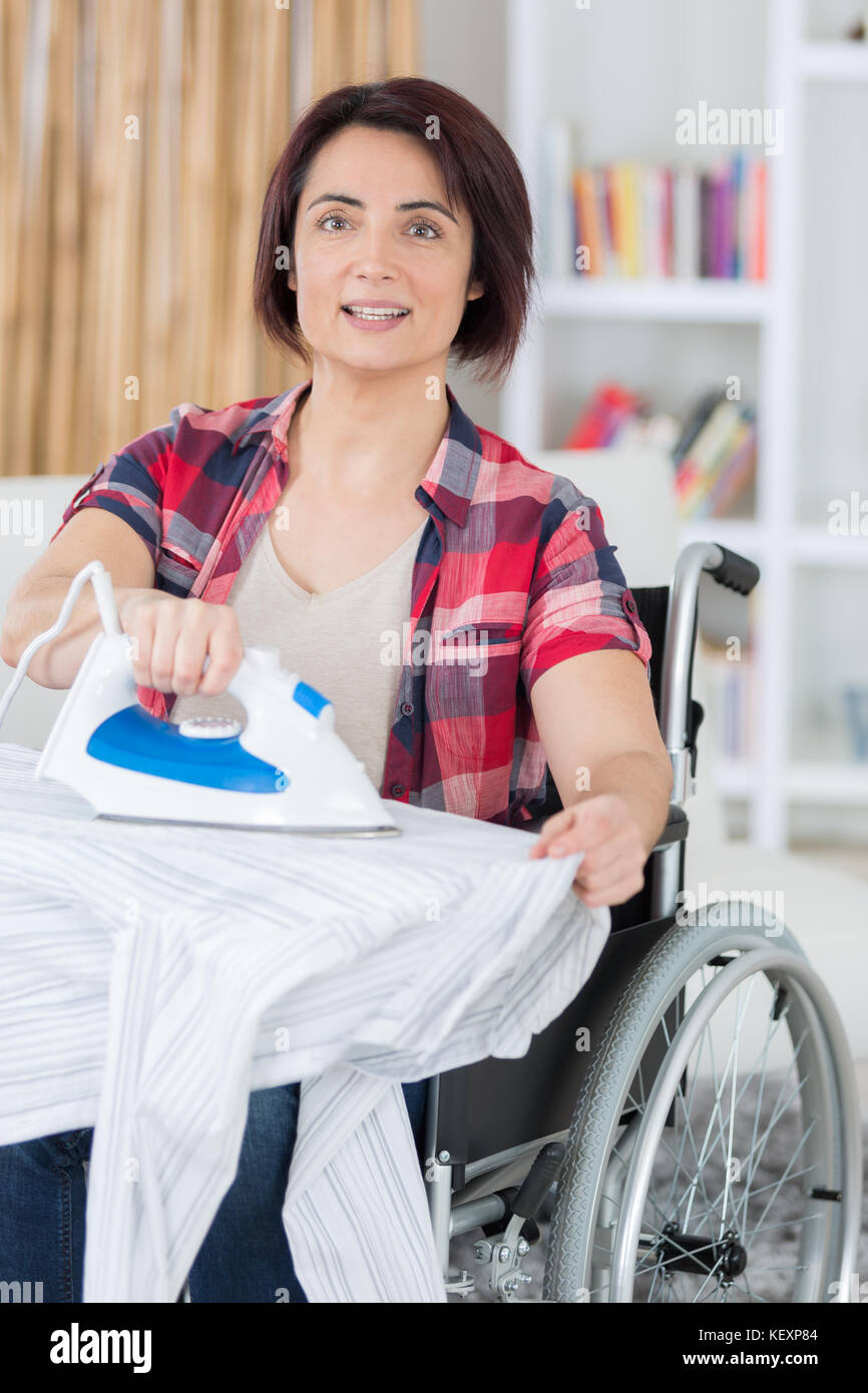 handicaped person must do her housekeeping herself Stock Photo - Alamy