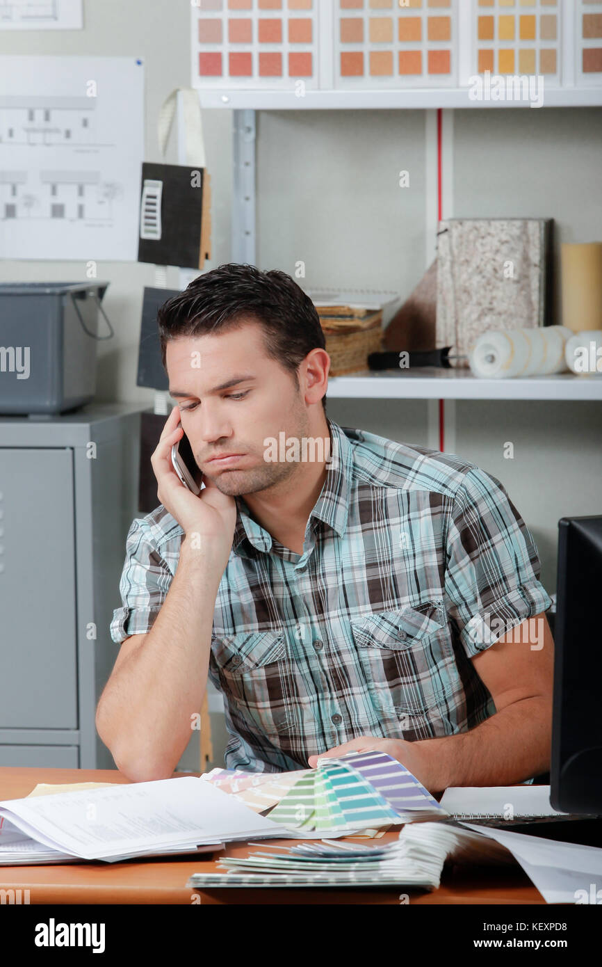 Seriously fed-up office worker Stock Photo - Alamy