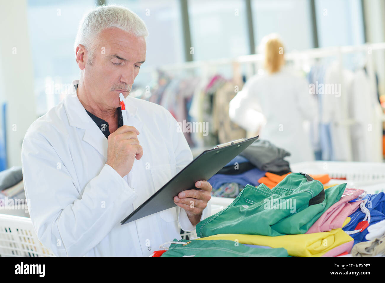 checking the laundry record Stock Photo - Alamy