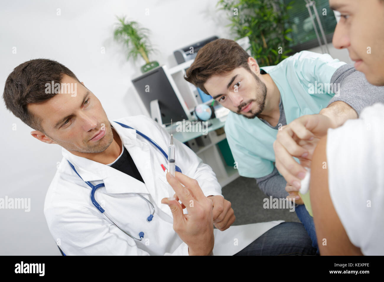 doctor doing injured man tetanus toxoid injection Stock Photo - Alamy
