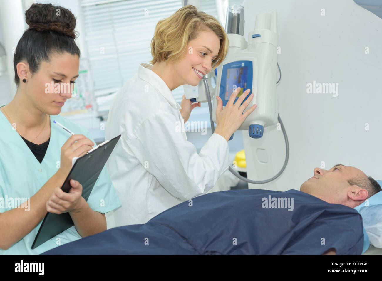nurse taking notes when doctor talking to patient in ward Stock Photo ...