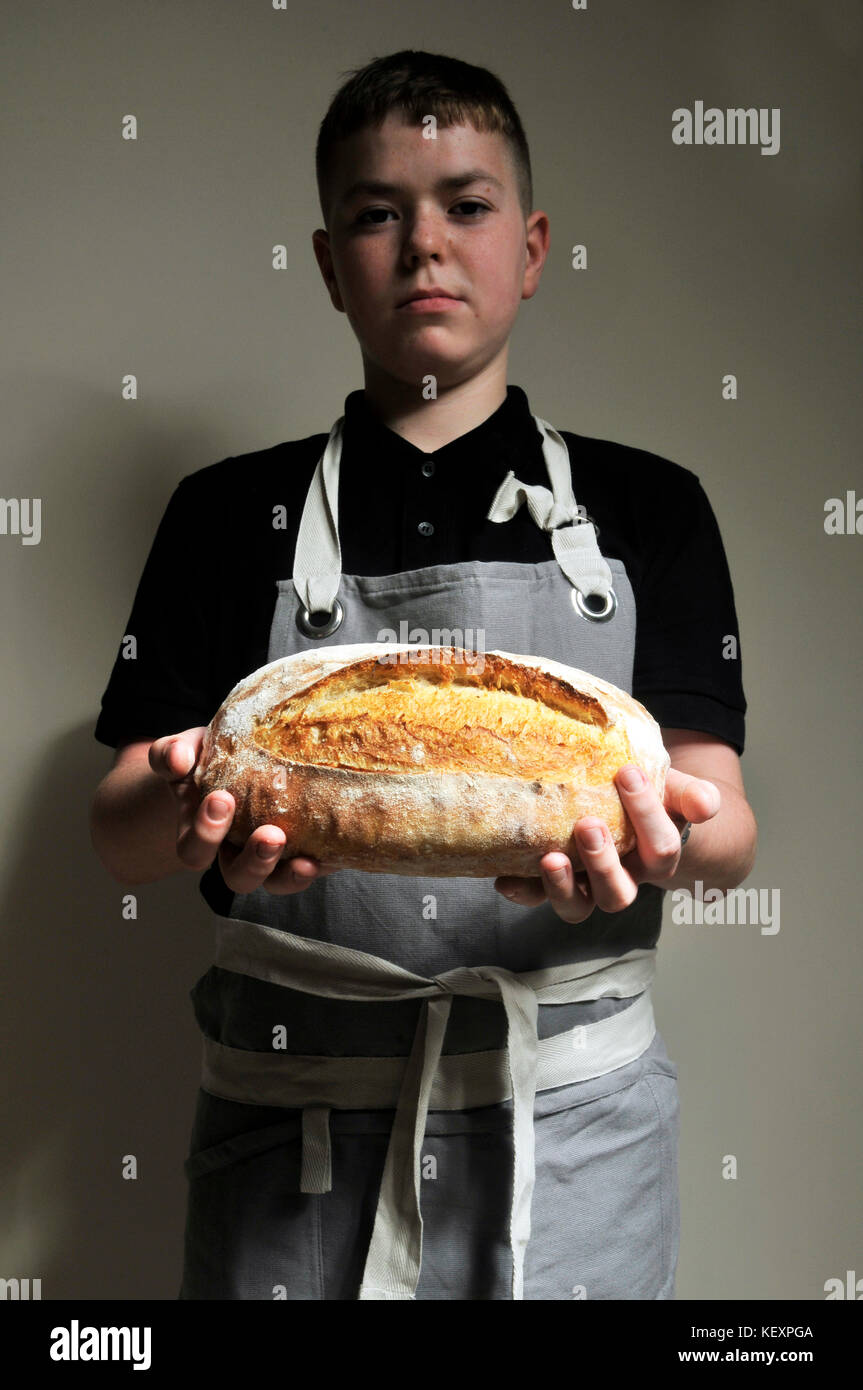 Young boy baking bread Stock Photo - Alamy