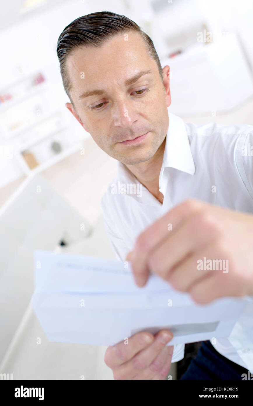 man reading a letter Stock Photo - Alamy