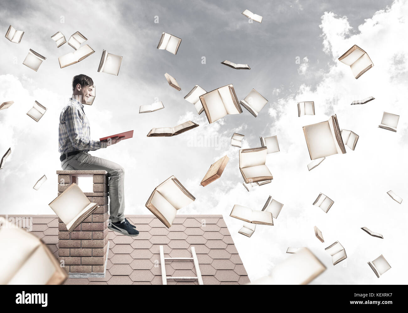 Man reading book and many of them flying in air Stock Photo - Alamy