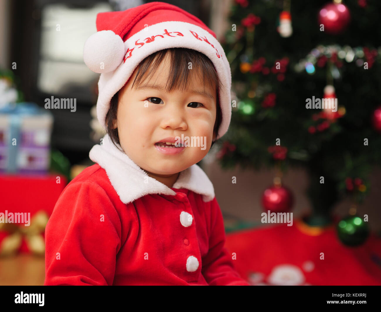 Happy santa baby girl Stock Photo - Alamy