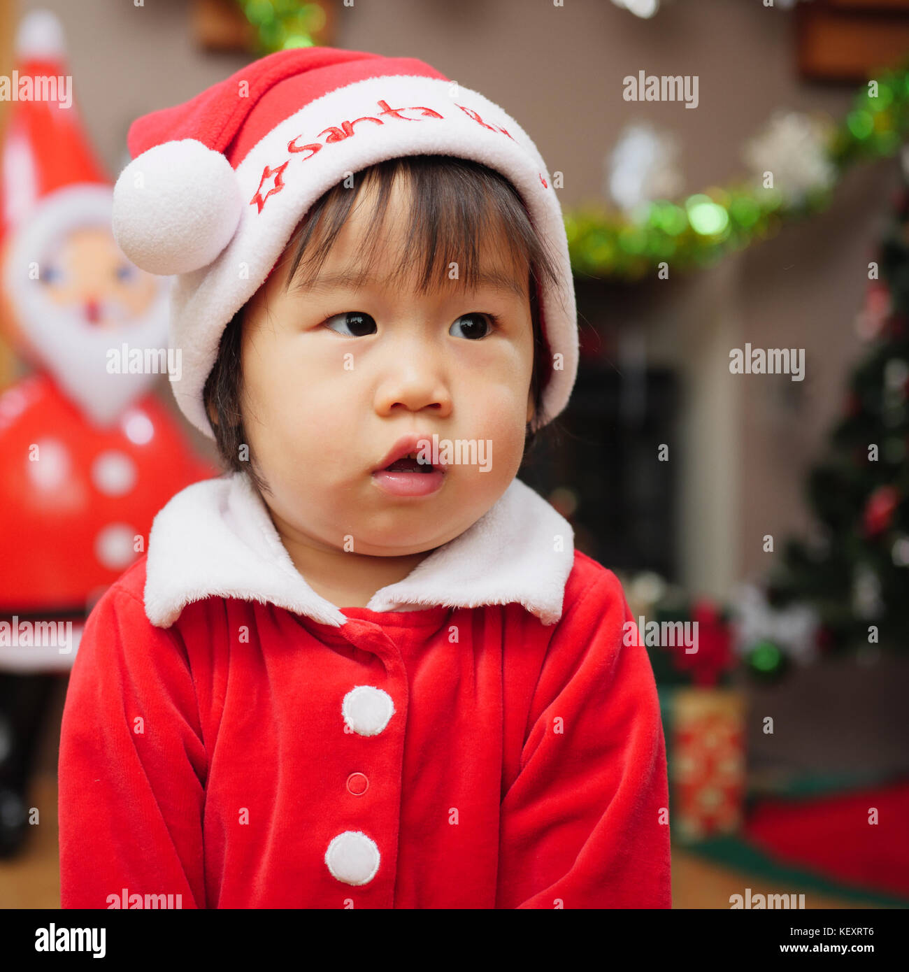 Happy santa baby girl Stock Photo - Alamy