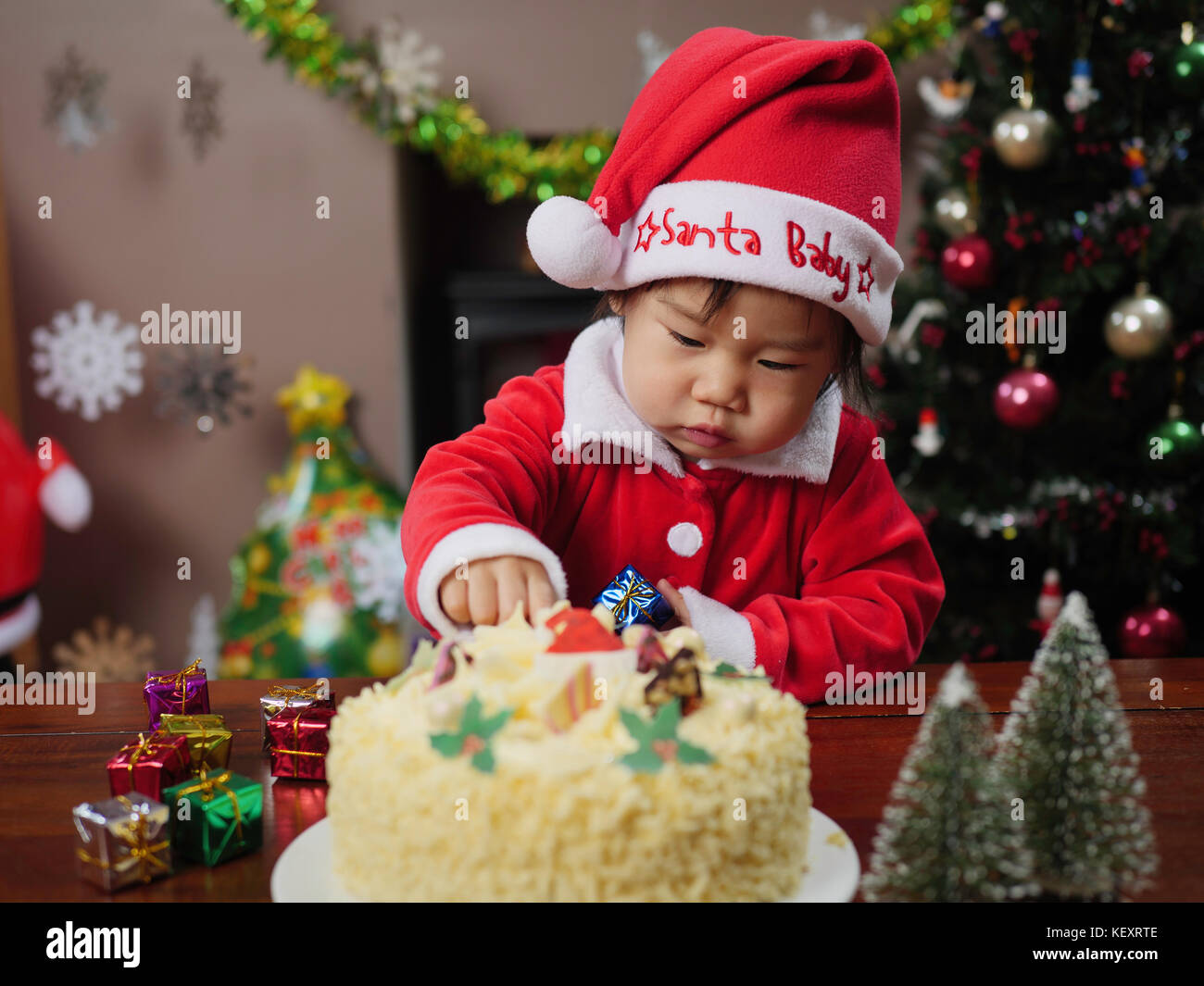 Happy santa baby girl Stock Photo - Alamy