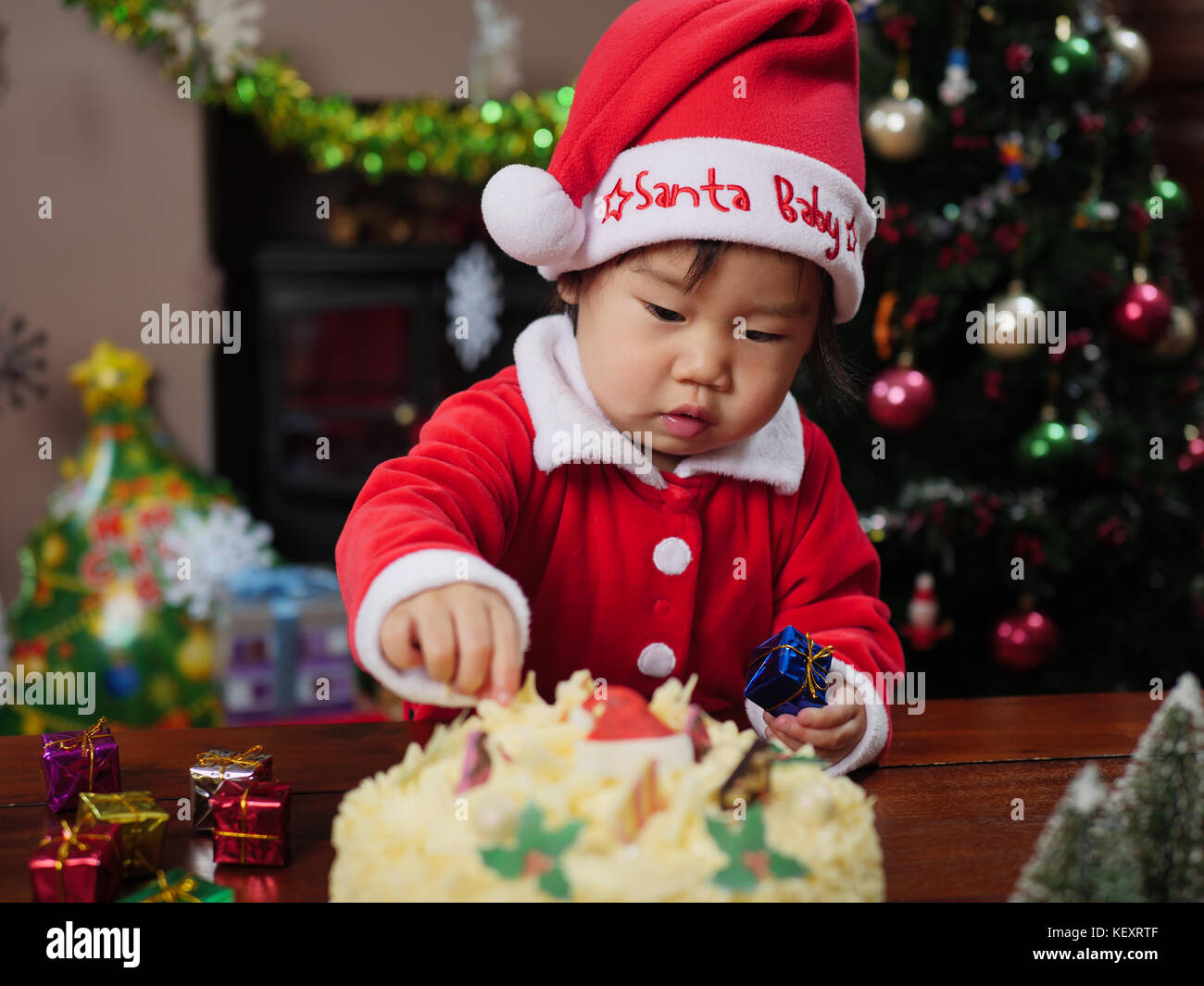 Happy santa baby girl Stock Photo - Alamy