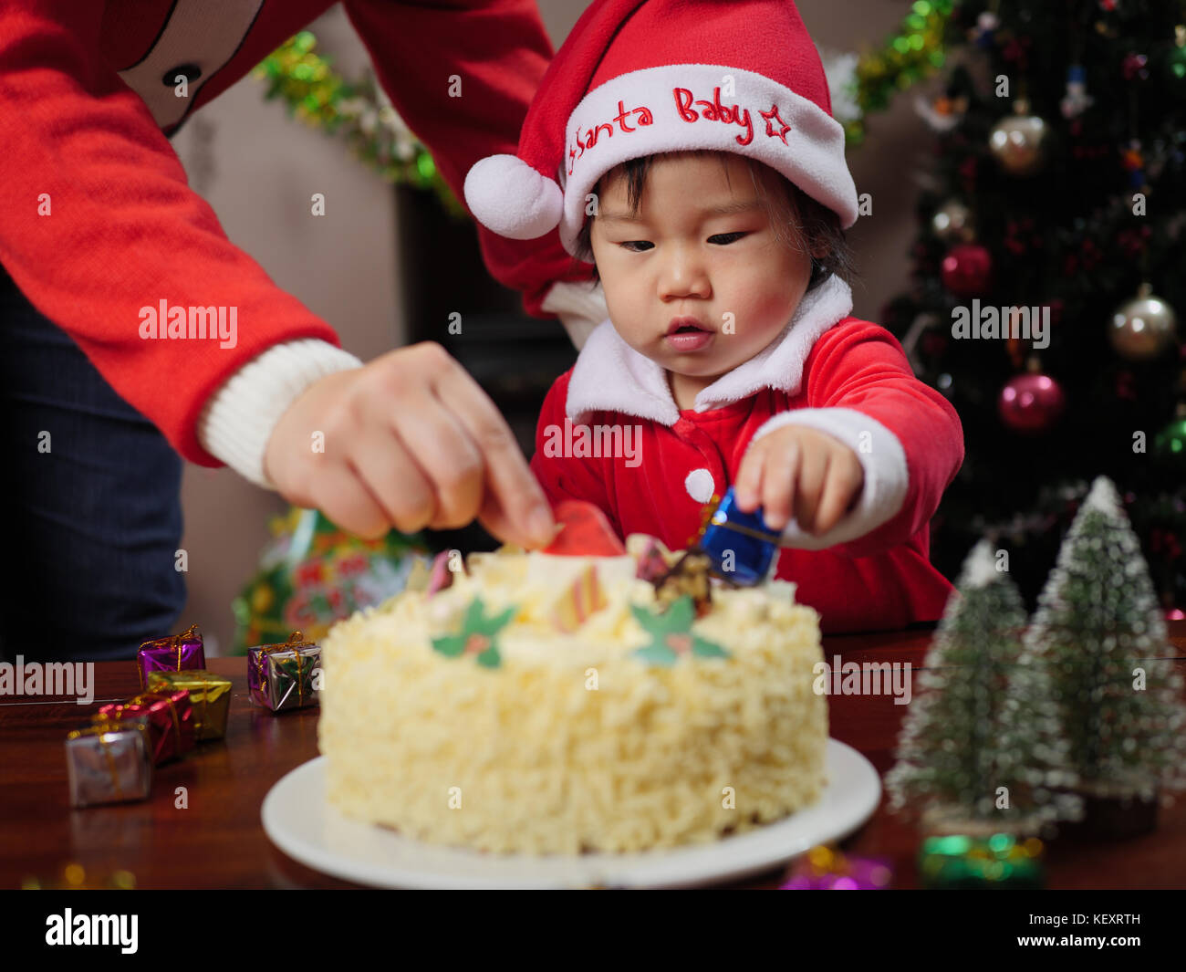Happy santa baby girl Stock Photo - Alamy