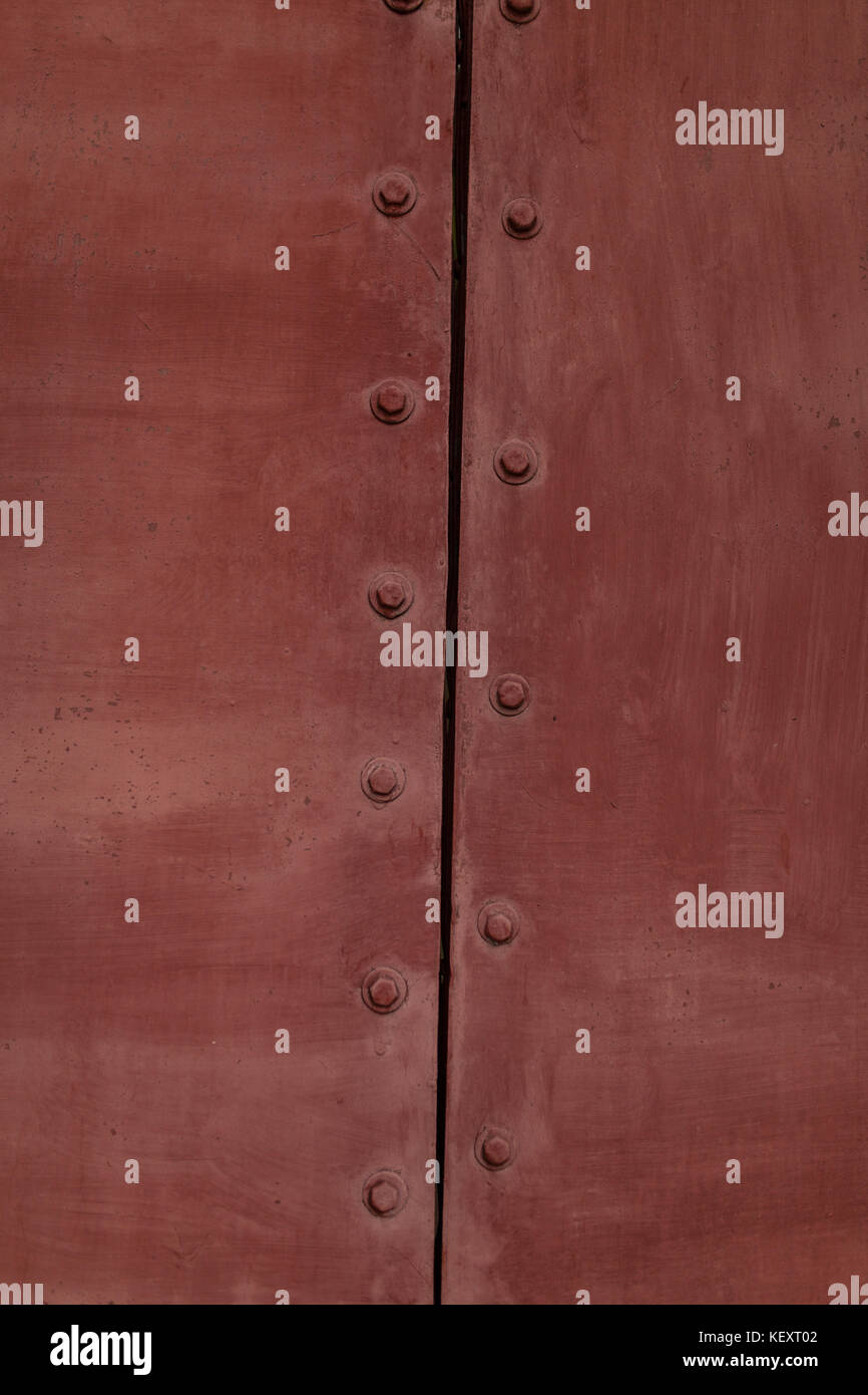 old rusty metal plate with a seam and rivets Stock Photo - Alamy