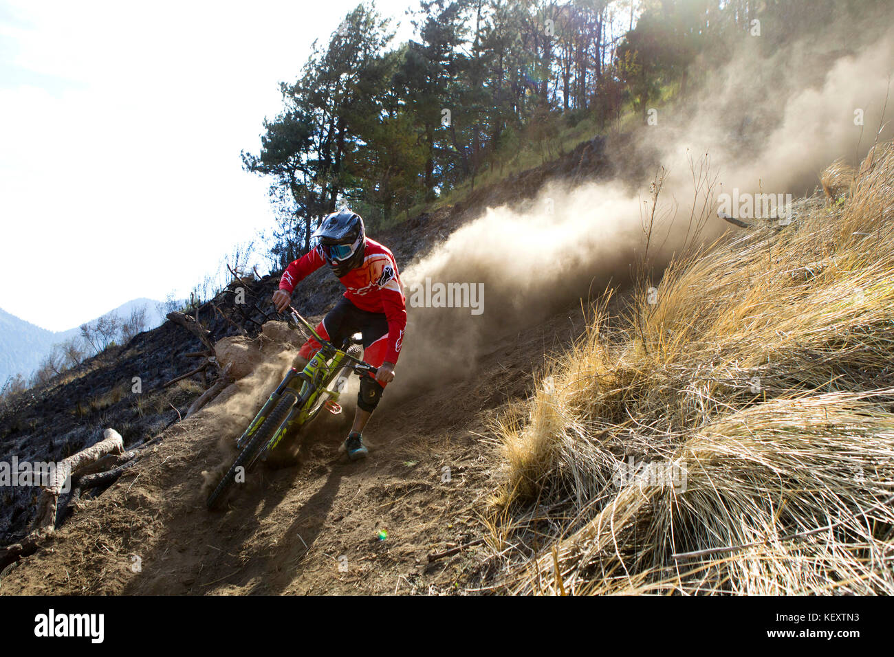 Biker raising dust on downhill track, Tenango, State of Mexico, Mexico ...