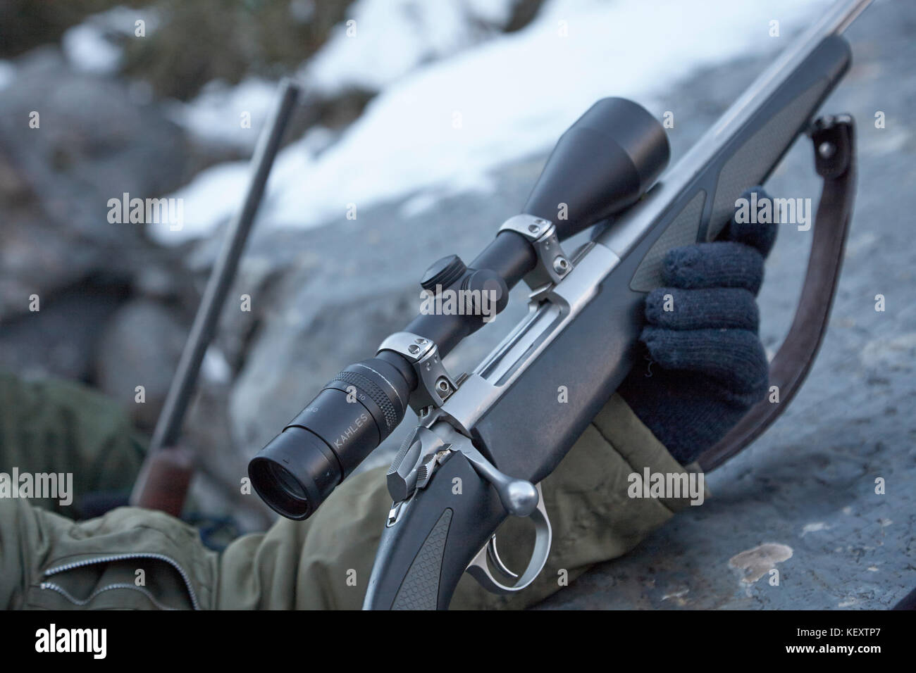 Hands of person holding rifle with telescopic sight outdoors, New ...