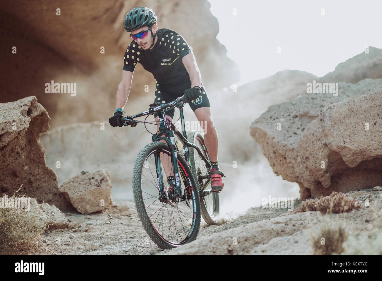 Man rides his mountain bike in desert, Tenerife, Canary Islands, Spain ...