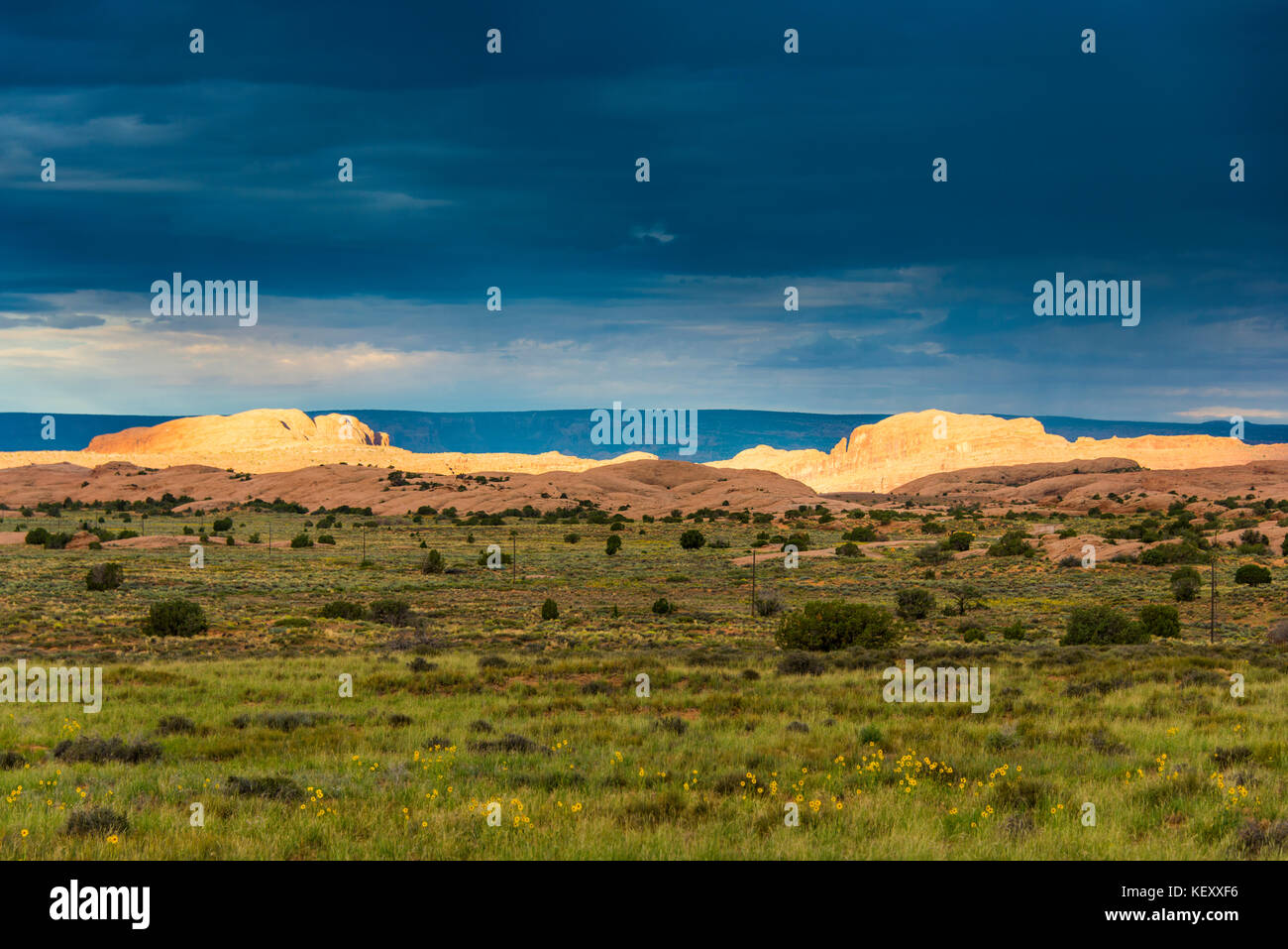 Early sun setting through the clouds around Moab, Utah, USA Stock Photo ...