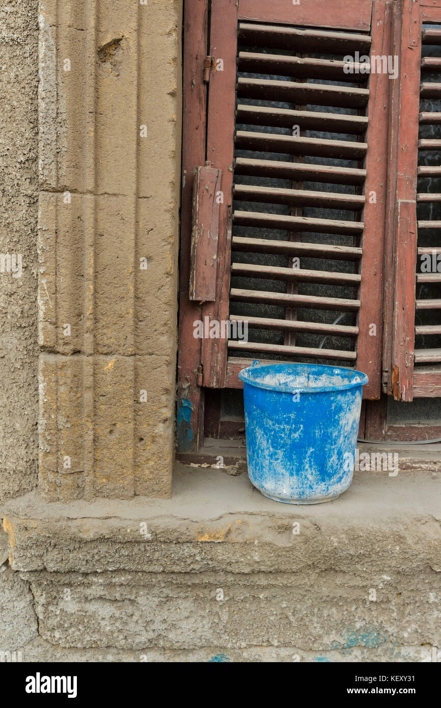 Blue bucket on stone windowsill, North Cyprus Stock Photo - Alamy
