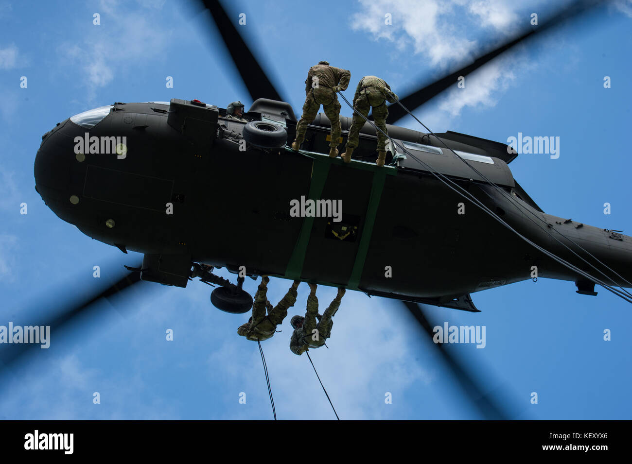 Rappelling from a helicopter Stock Photo - Alamy