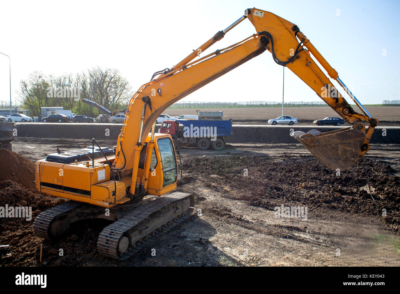 excavator at sandpit during earthmoving works Stock Photo - Alamy