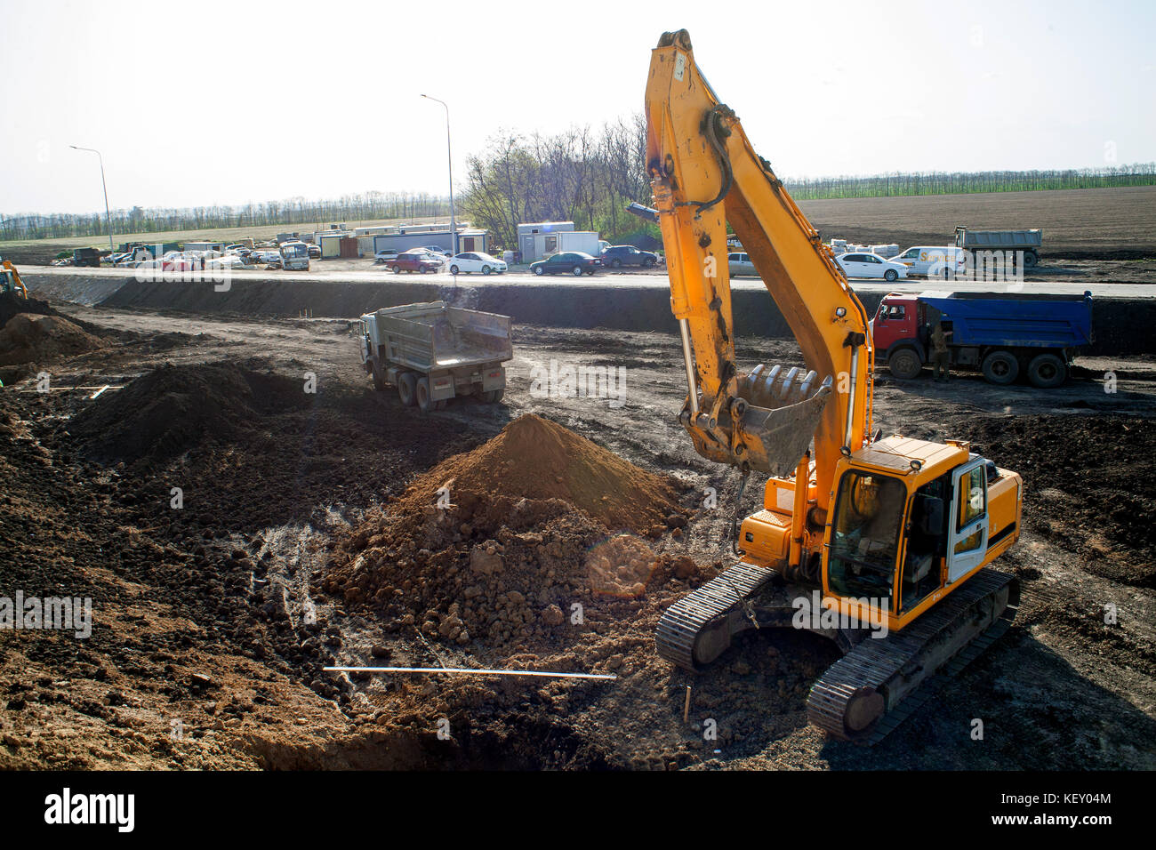 excavator at sandpit during earthmoving works Stock Photo - Alamy