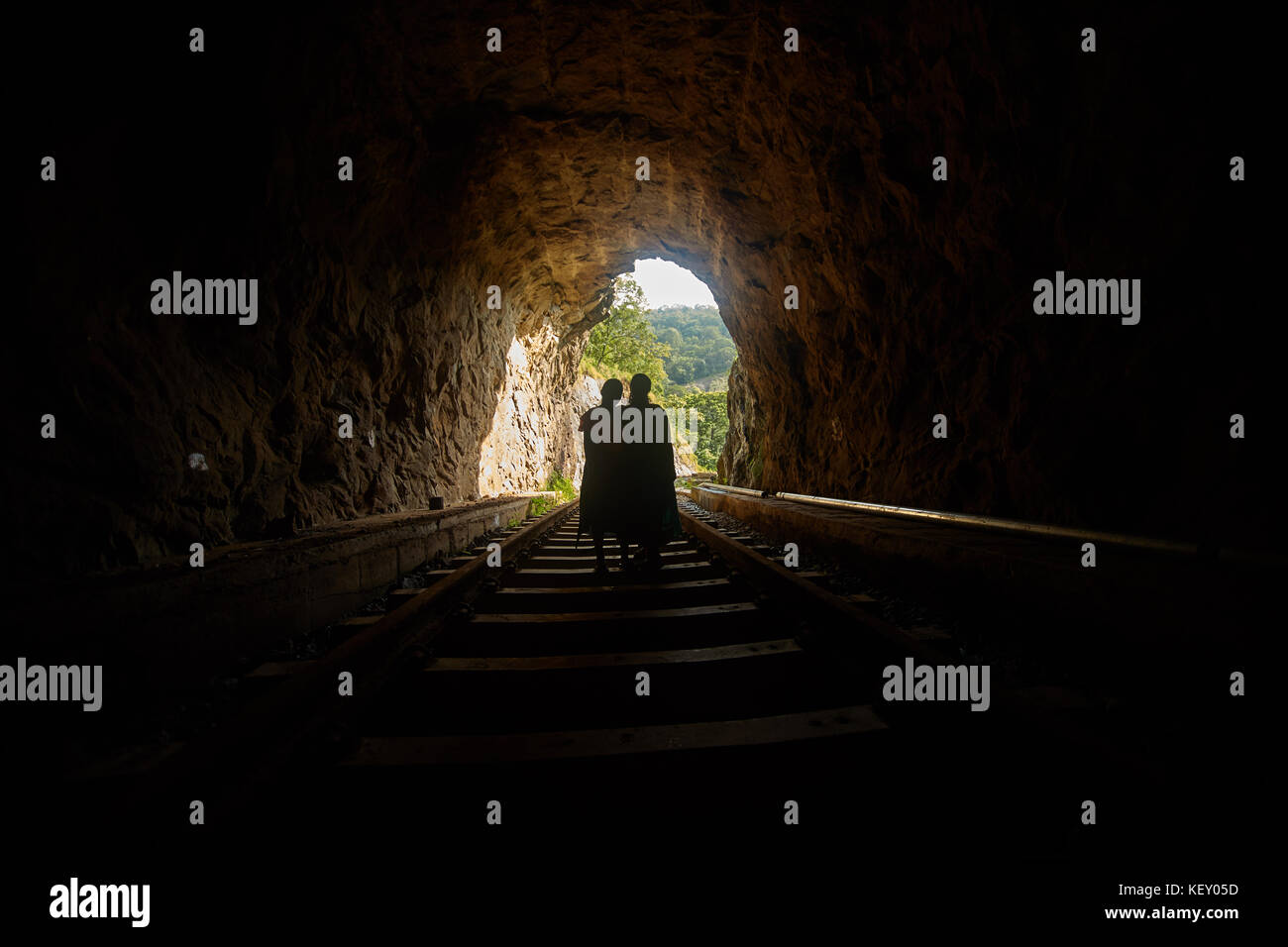 Exit from darknes - Light at end of tunnel, Shadow of people Standing ...