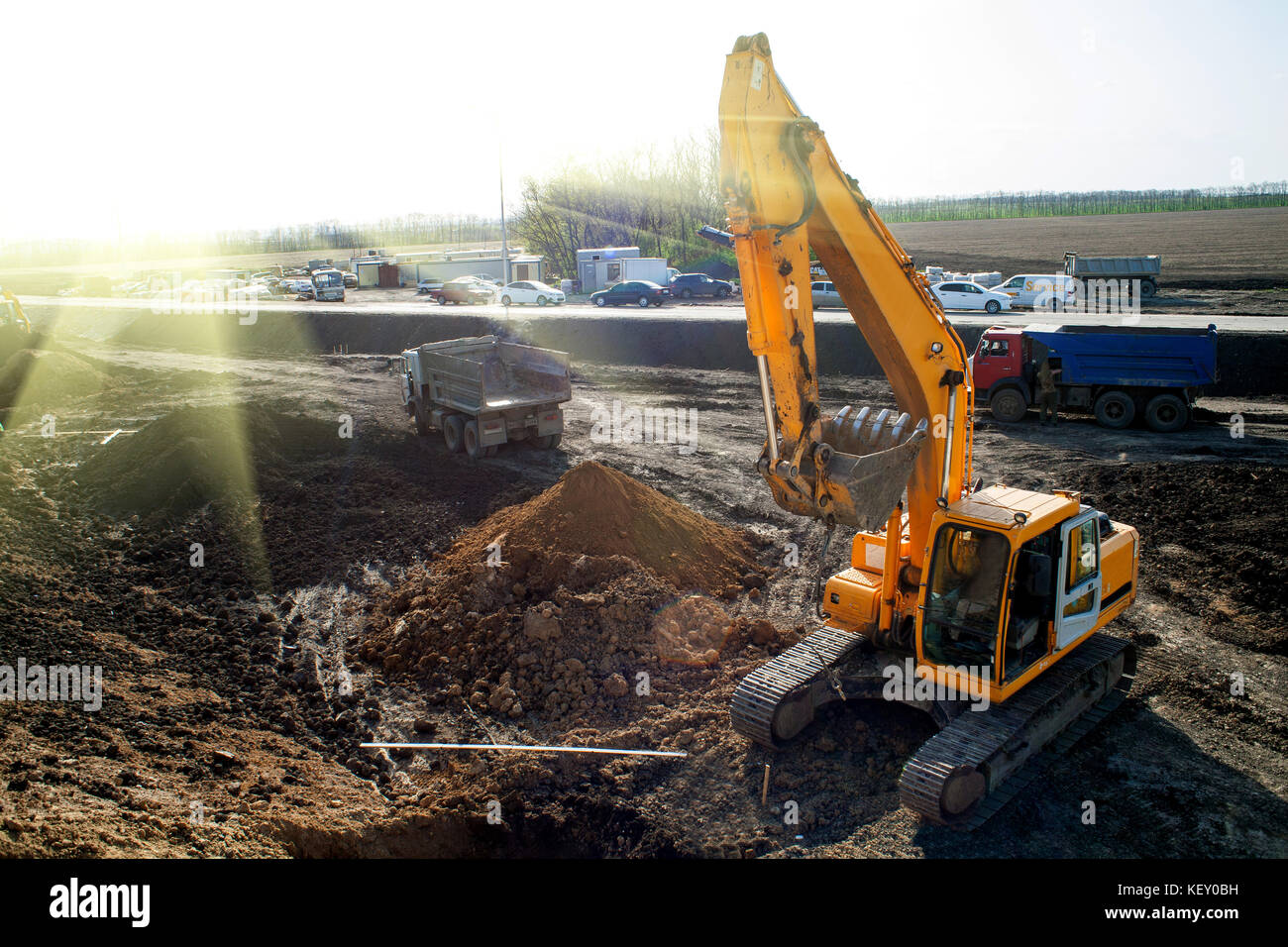 excavator at sandpit during earthmoving works Stock Photo - Alamy