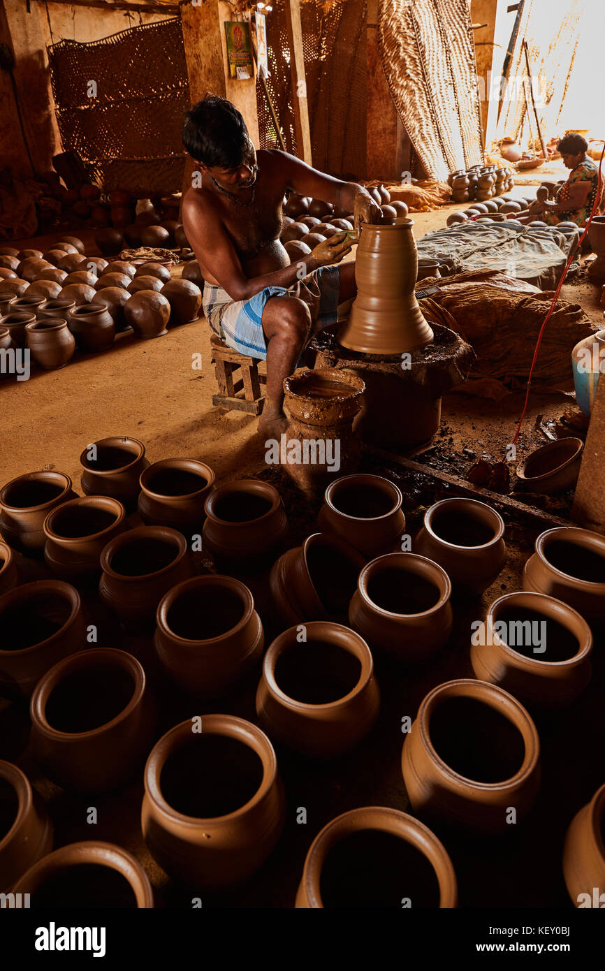 Hands of making clay pot on the pottery wheel ,select focus, close-up ...