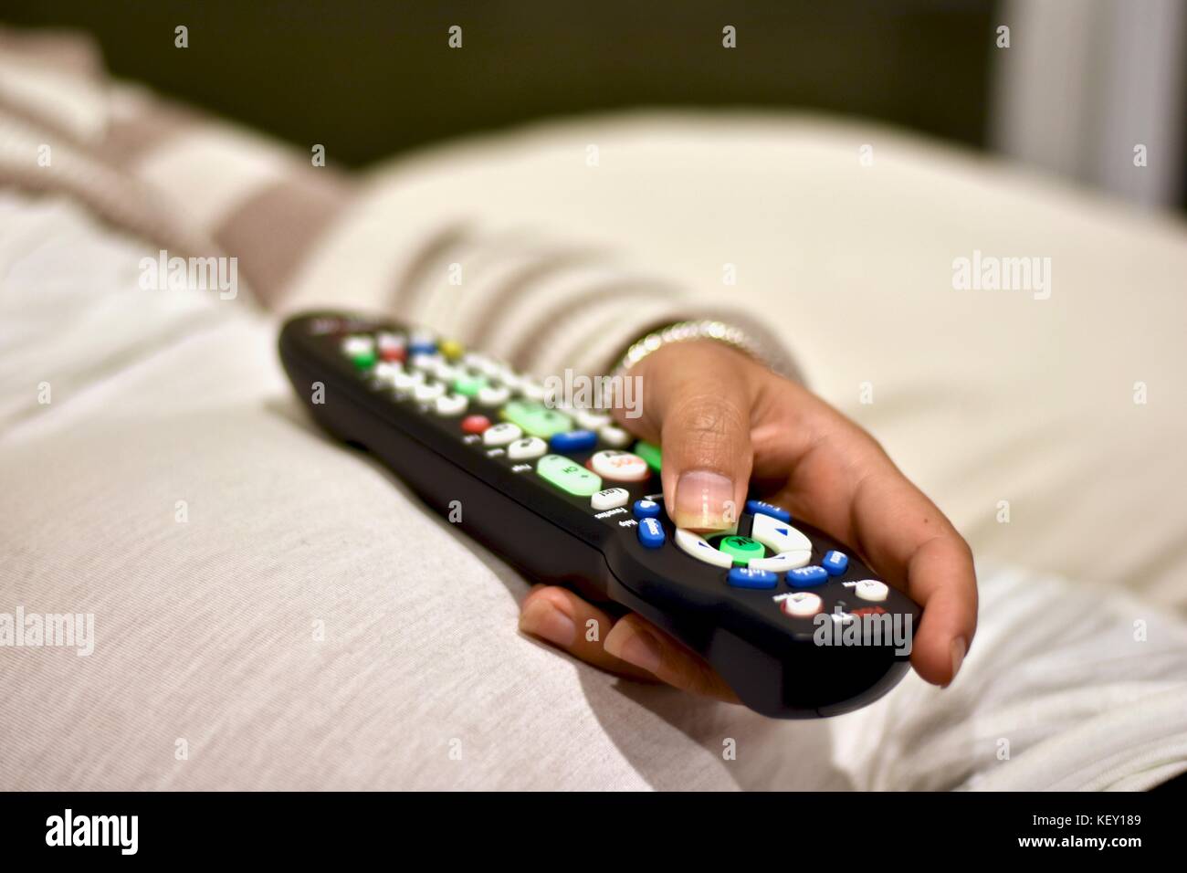 Woman hand holding remote hi-res stock photography and images - Alamy