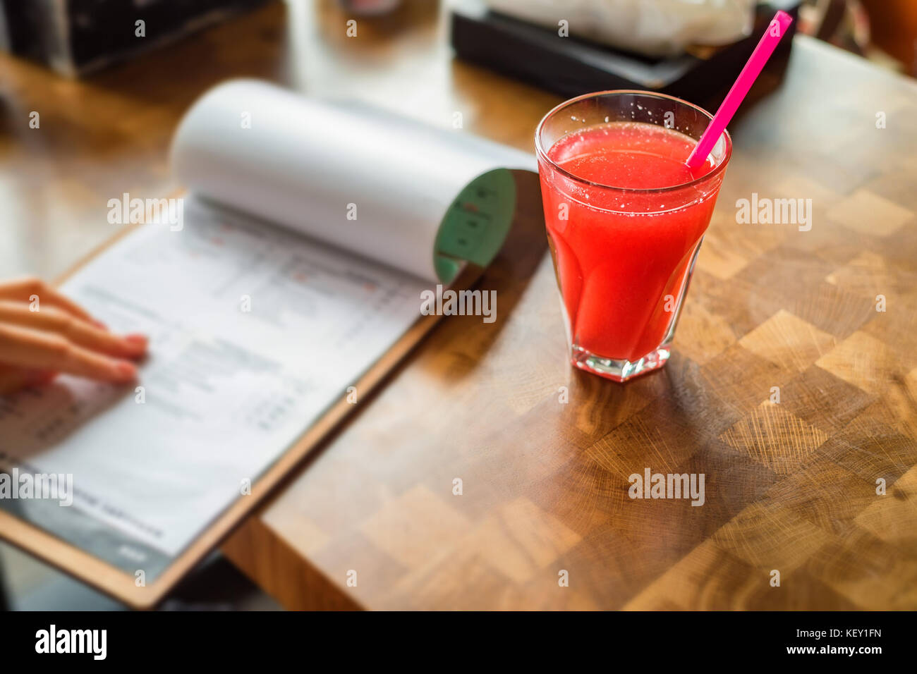 Ordering meal using menu in cafe Stock Photo - Alamy