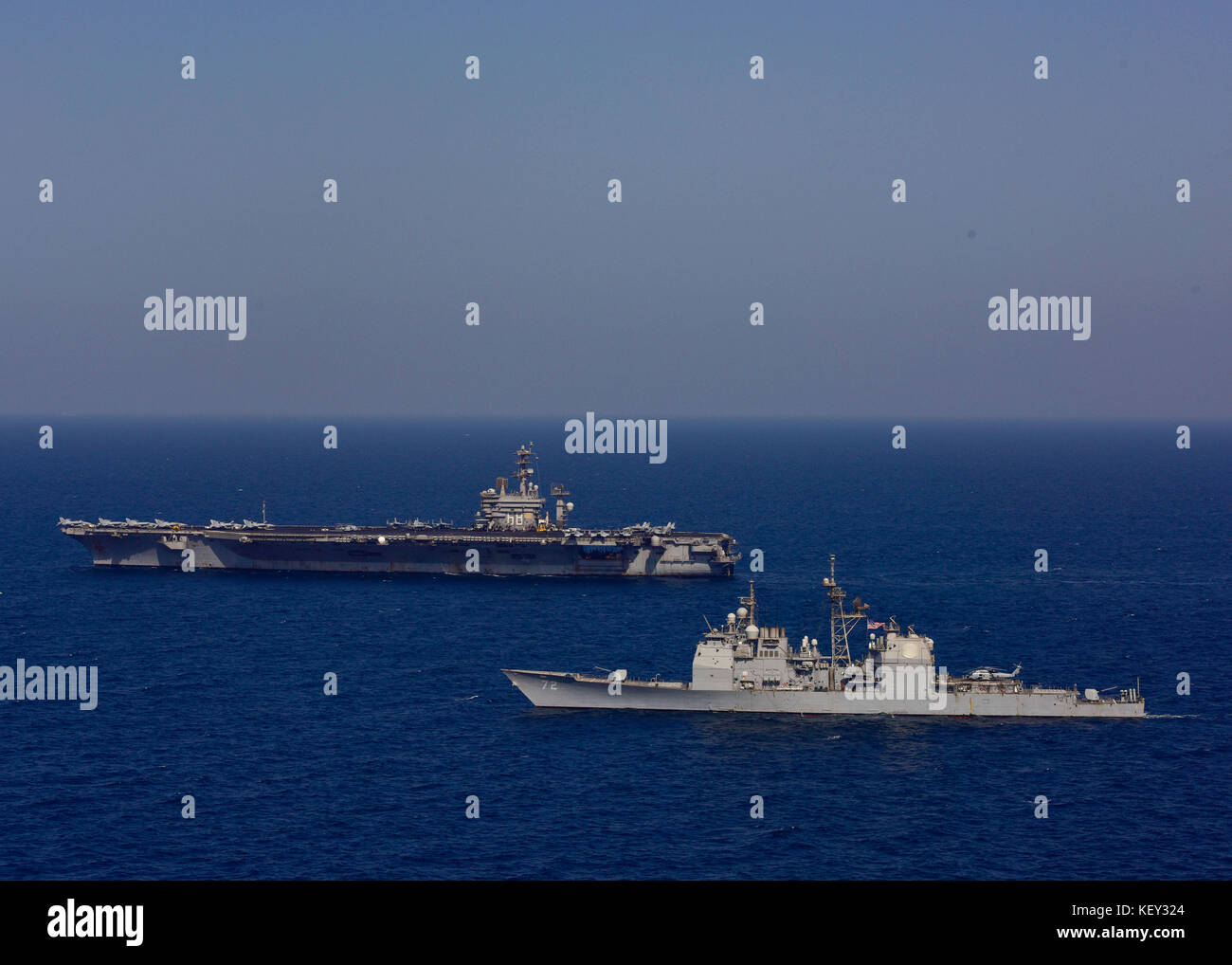 The aircraft carrier USS Nimitz (CVN 68) and the Ticonderoga-class ...