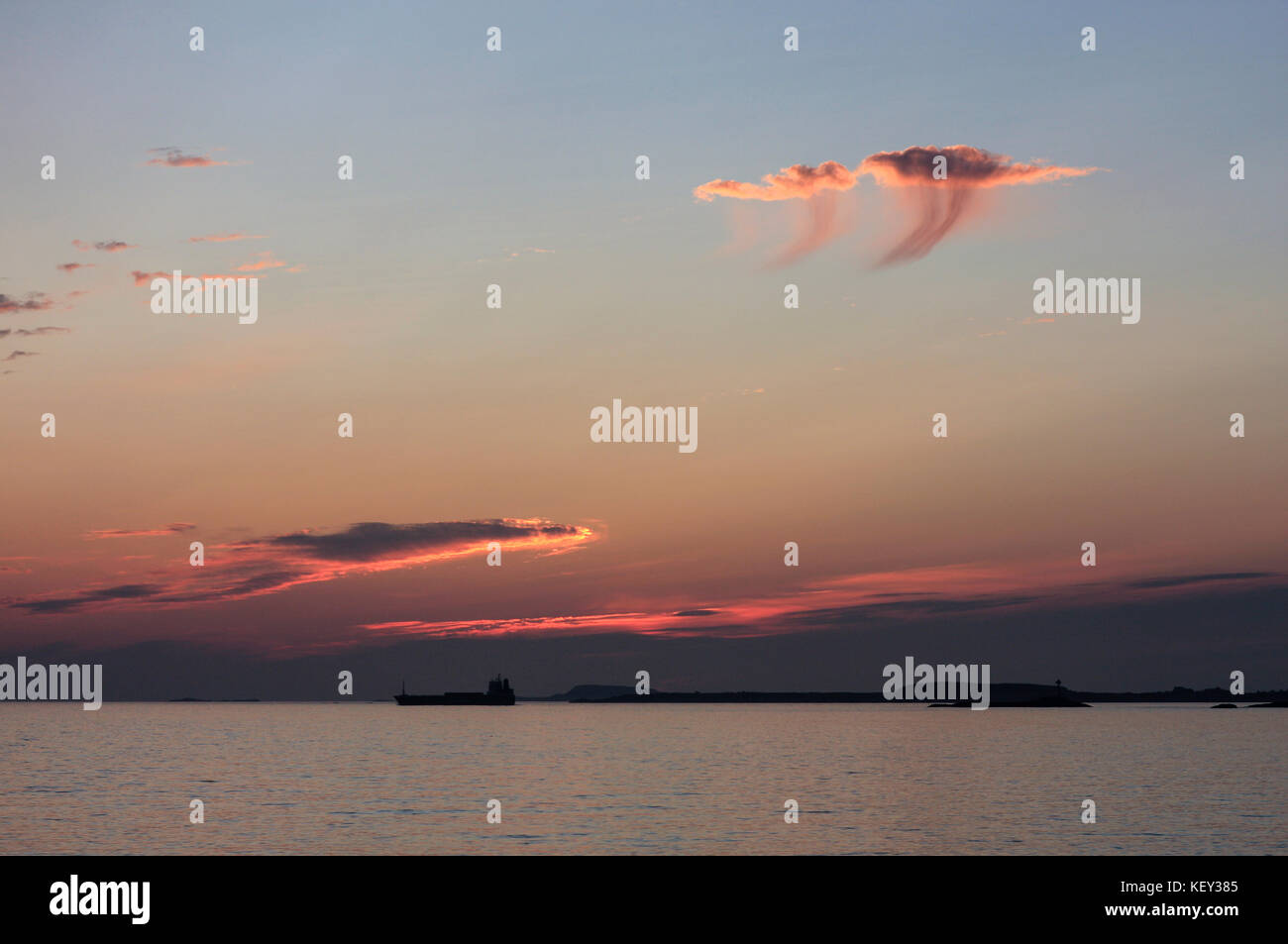 Sunset, nightfall or twilight by the North Sea in July. Shore this side ...
