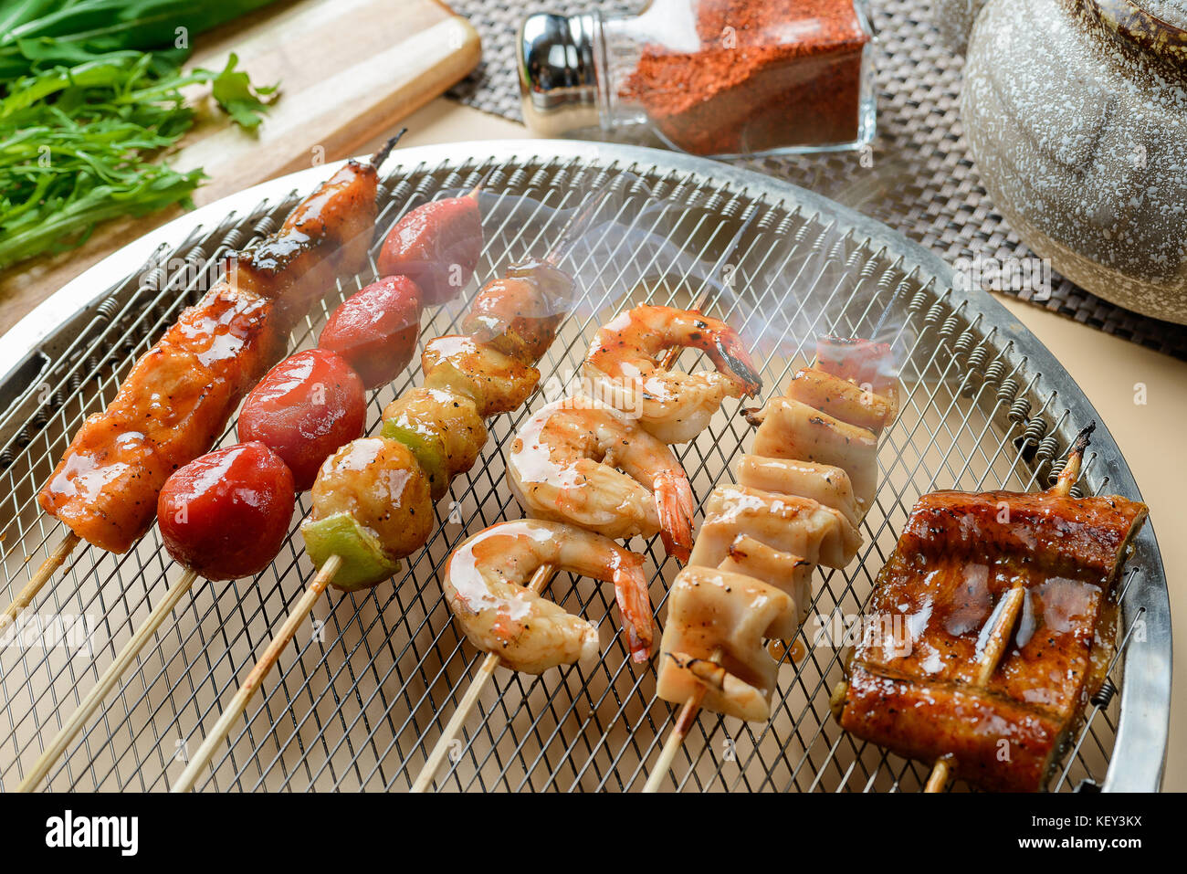 Seafood barbecue on grill Stock Photo - Alamy