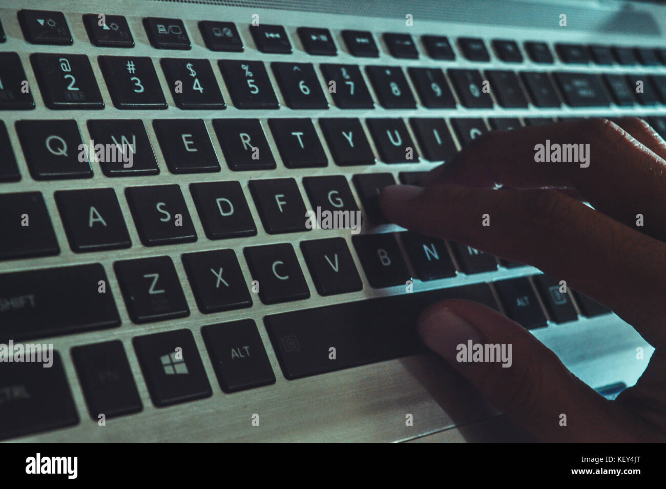 human finger is typing on a keyboard Stock Photo - Alamy