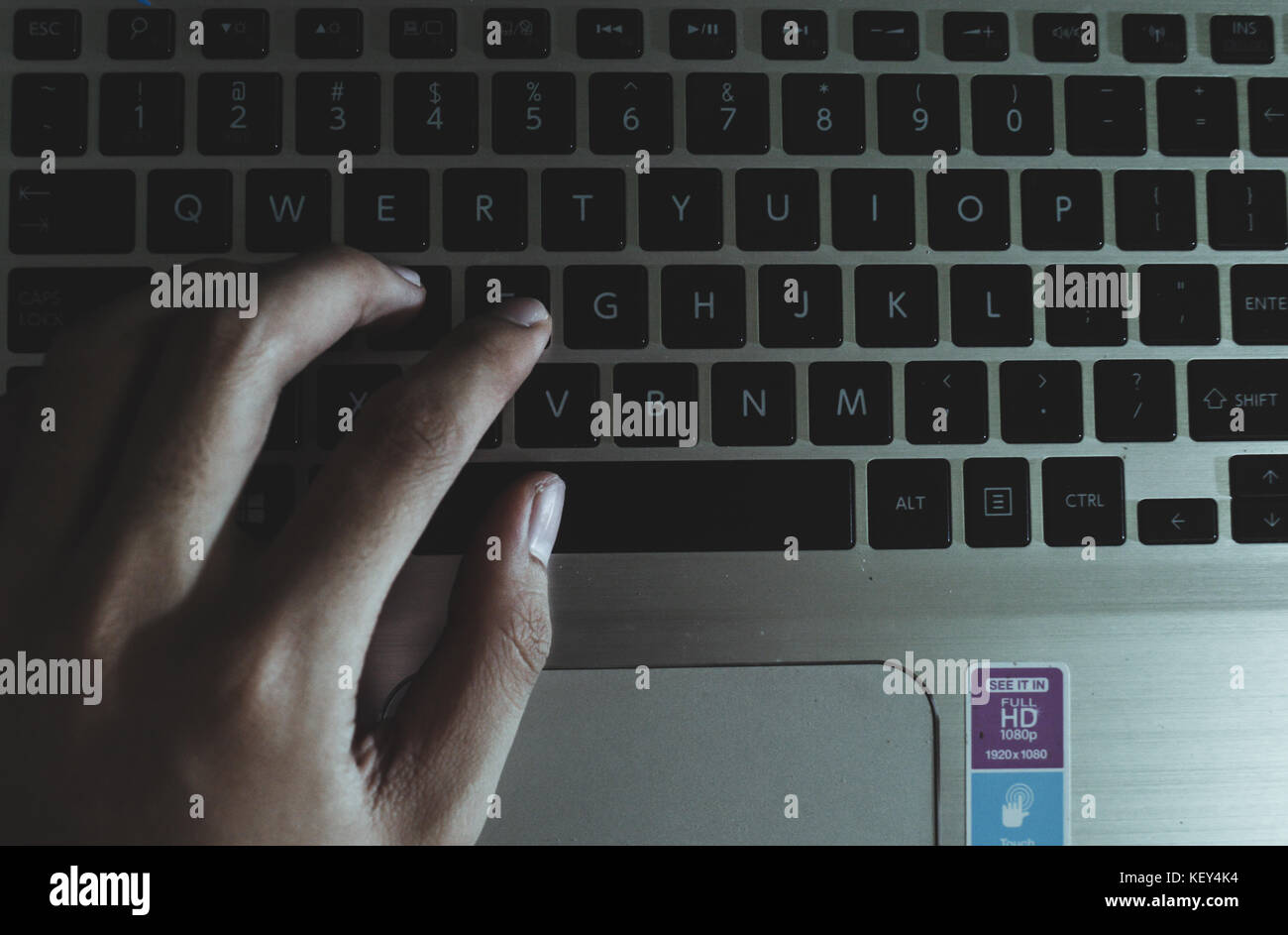 human finger is typing on a keyboard Stock Photo - Alamy