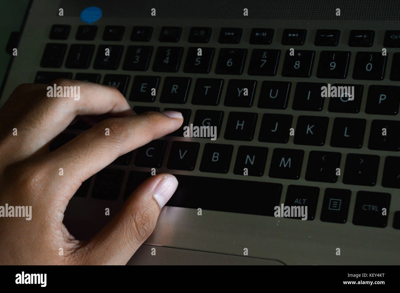 human finger is typing on a keyboard Stock Photo - Alamy