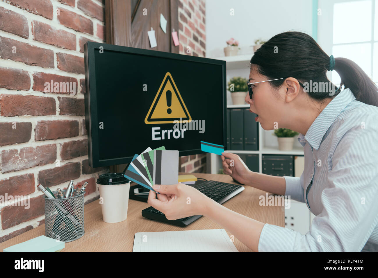 confused business woman trying all personal credit card paying but ...