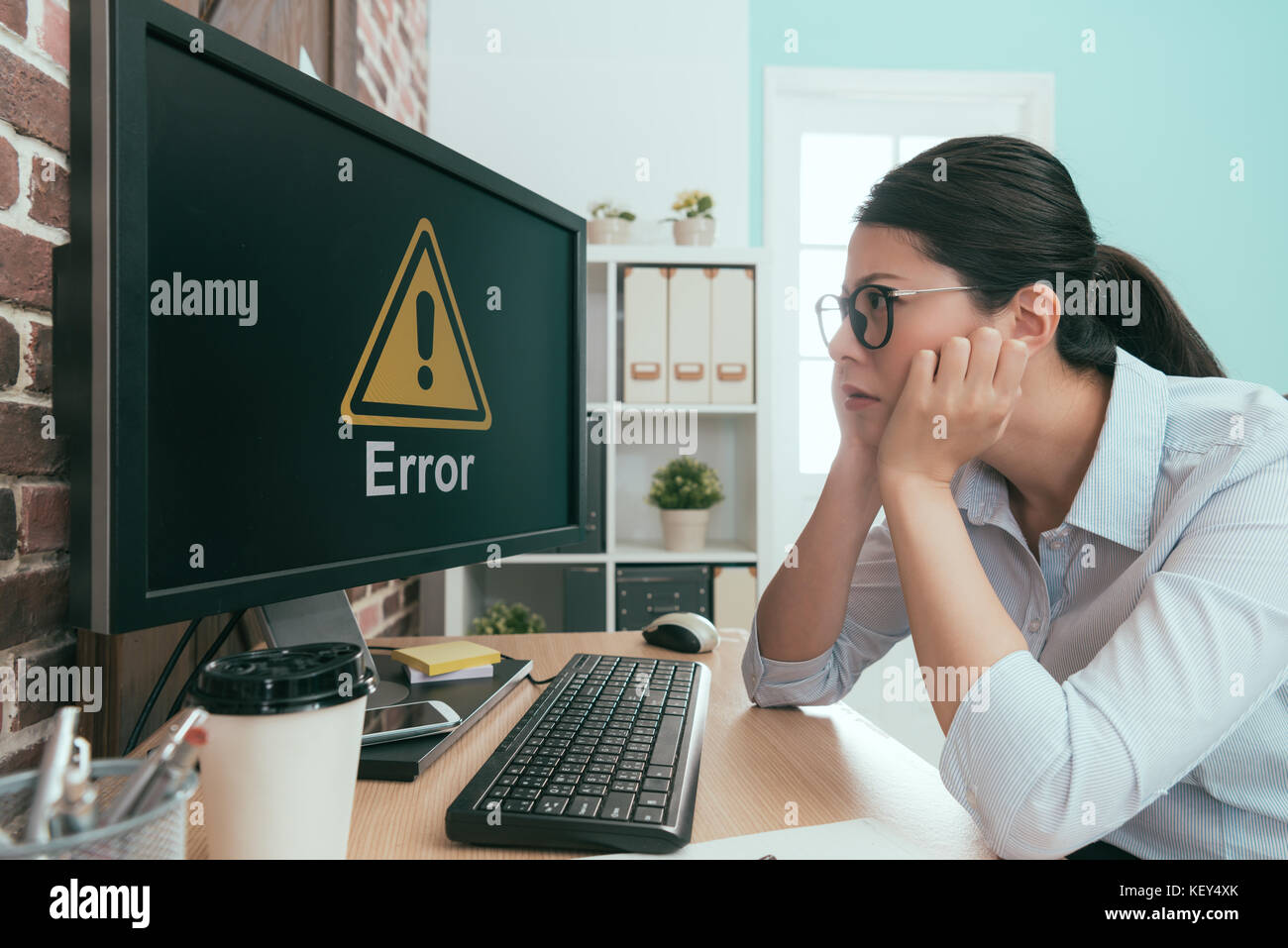unhappy business lady looking at computer error information feeling ...