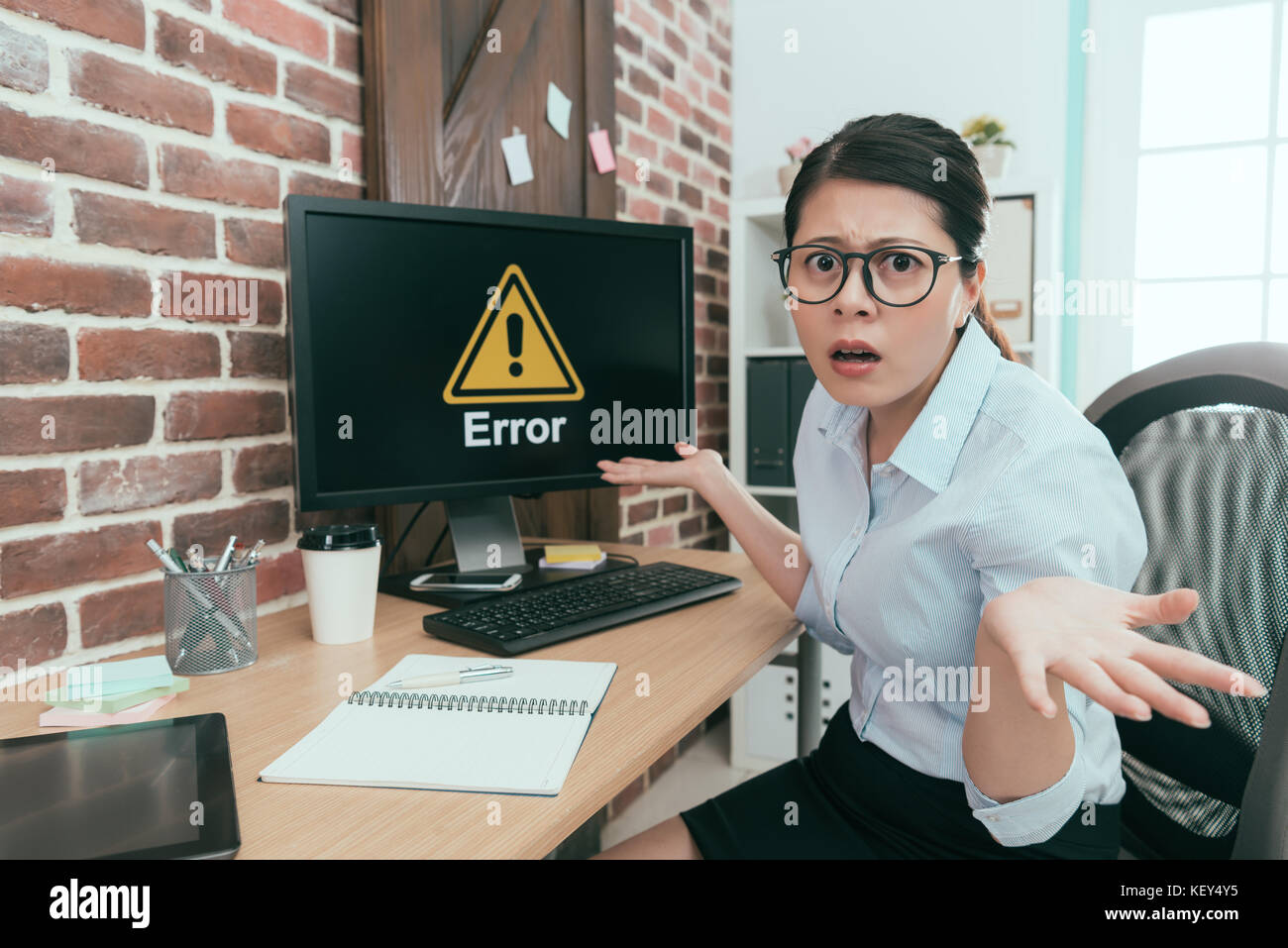 young agent woman looking at camera and showing confused posing when ...